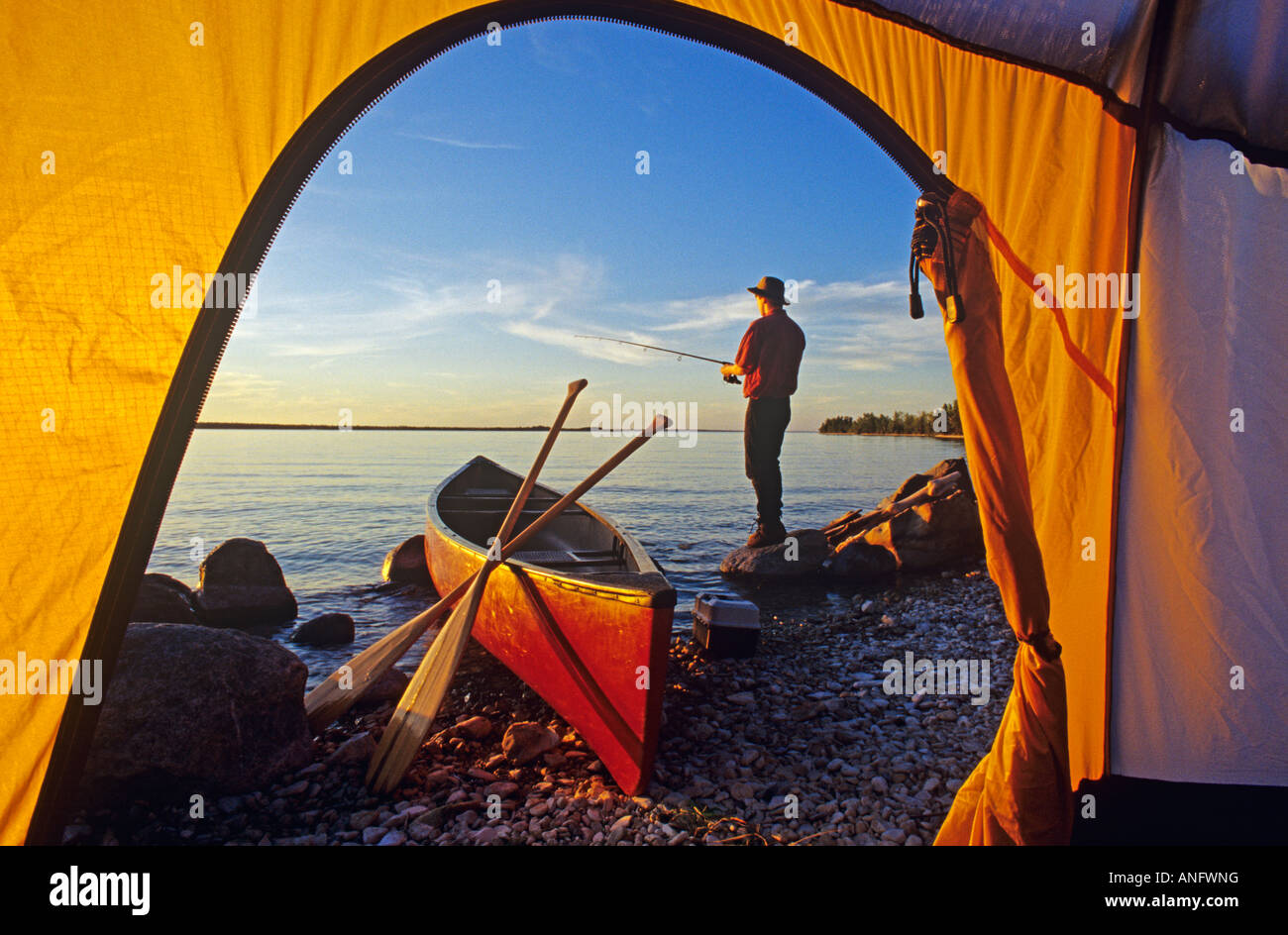 Twenty year old male fishing at Little Limestone Lake, Northern ...