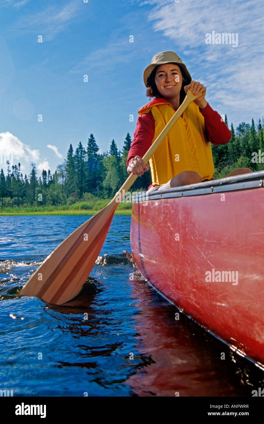 One woman alone paddling canoe hi-res stock photography and images - Alamy