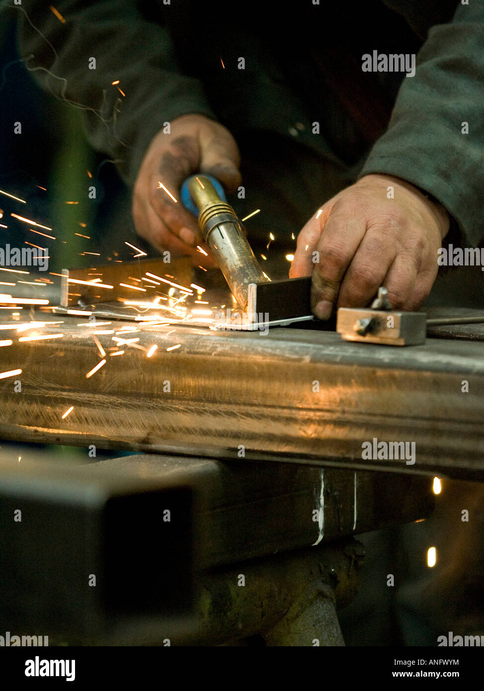 Metal worker in factory Stock Photo - Alamy