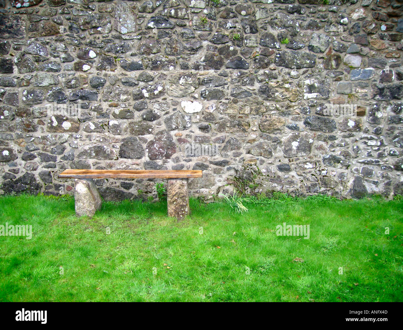 Empty wooden bench in country park ruins Stock Photo - Alamy
