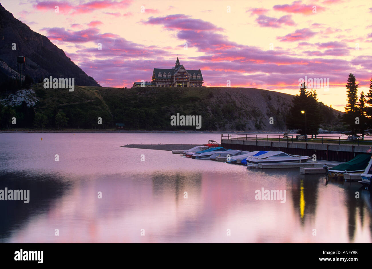 Historic Prince of Wales Hotel at sunset located above Waterton Lake in ...
