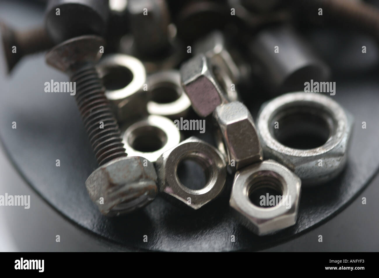 assortment of shiny silver nuts and bolts Stock Photo - Alamy