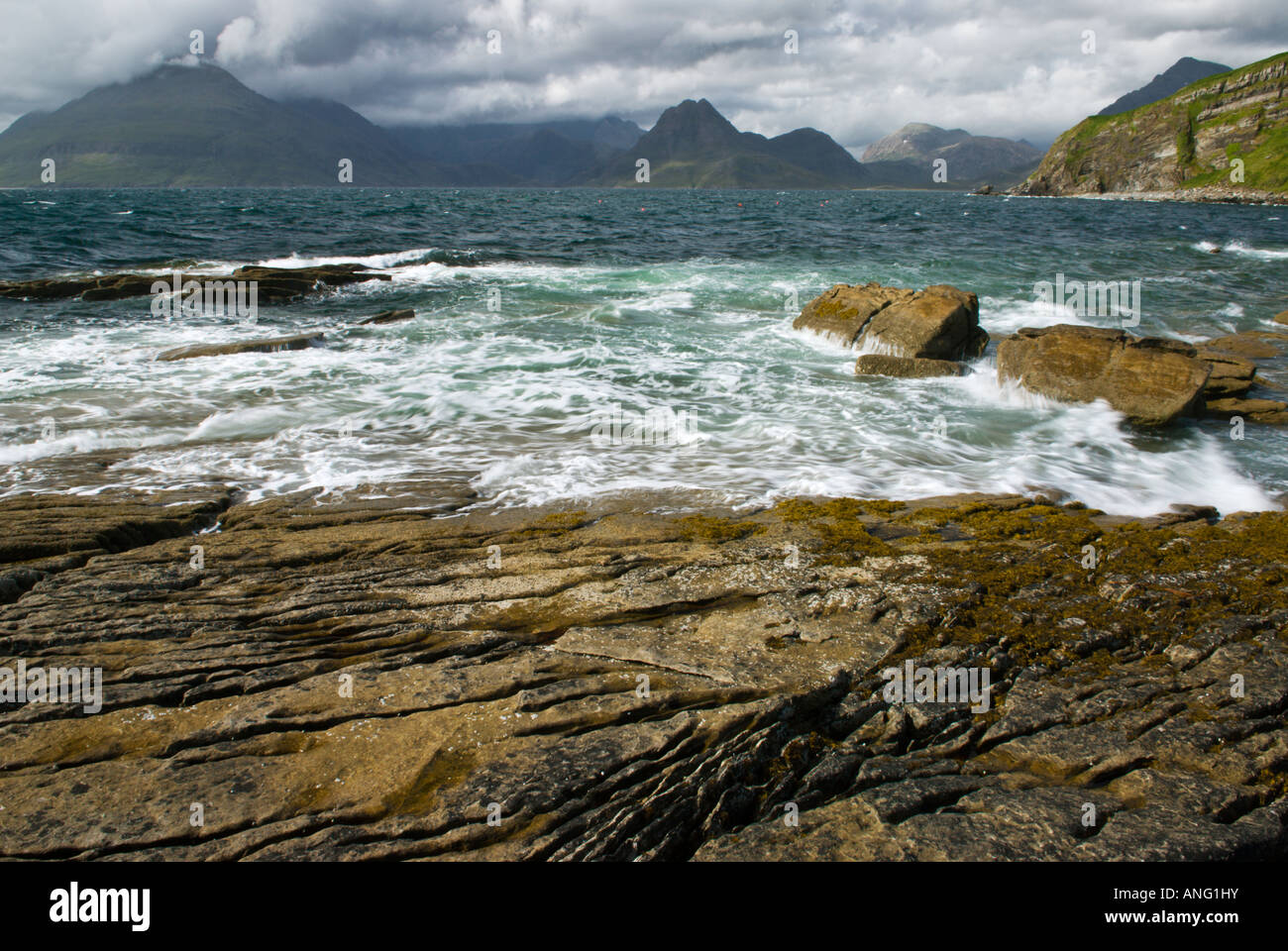 Waves Sea Surf Breaking On The Shoreline The Cuilin Mountains In The ...