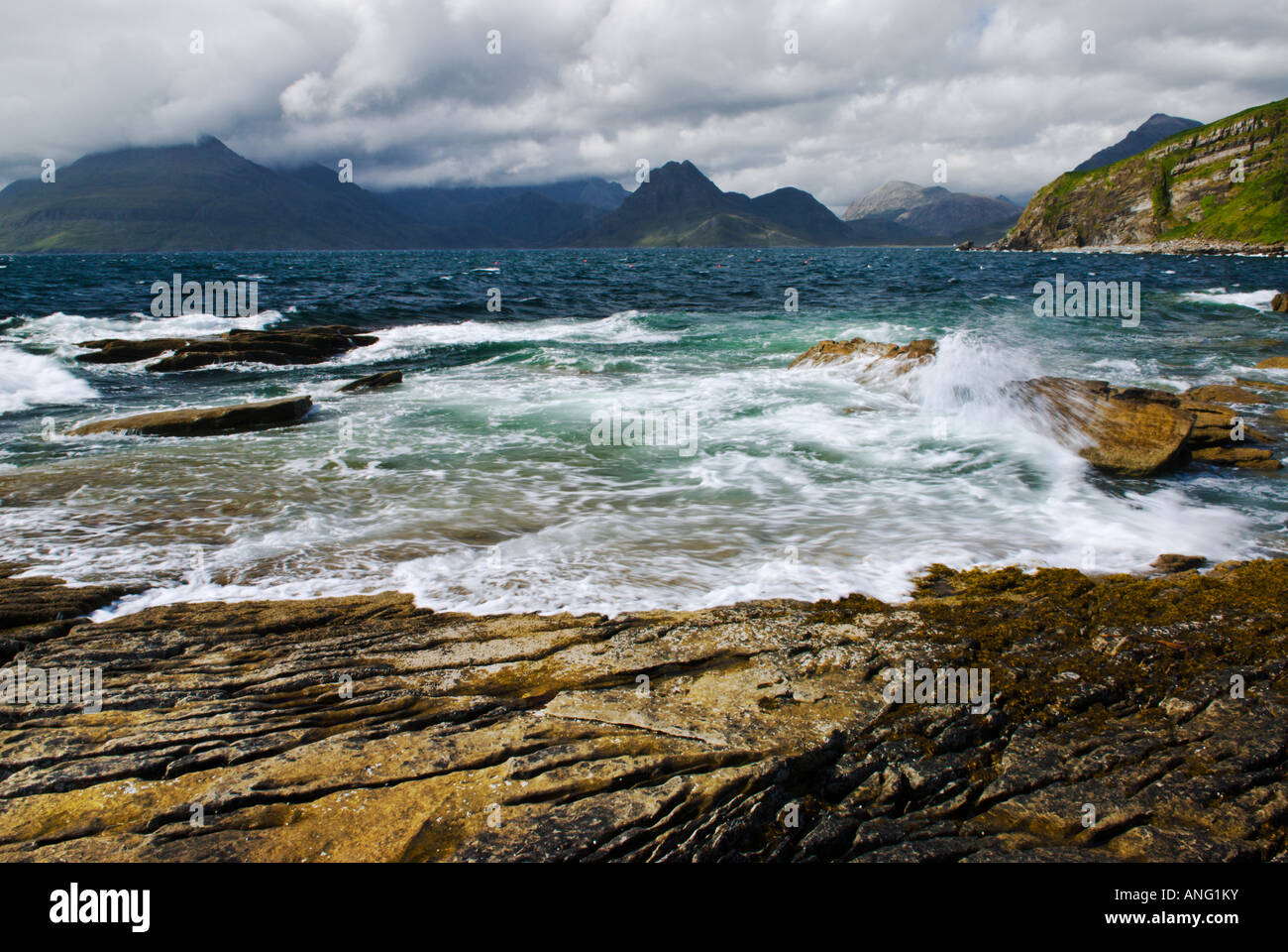Waves Sea Surf Breaking On The Shoreline The Cuilin Mountains In The ...