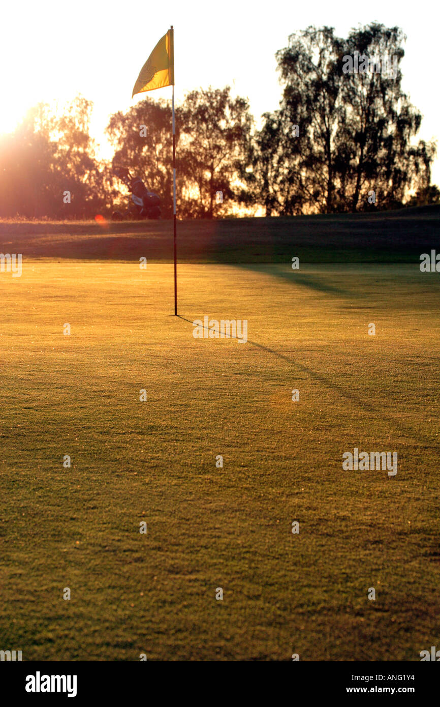 Flag on golf course blowing in wind during sunset - color Stock Photo ...