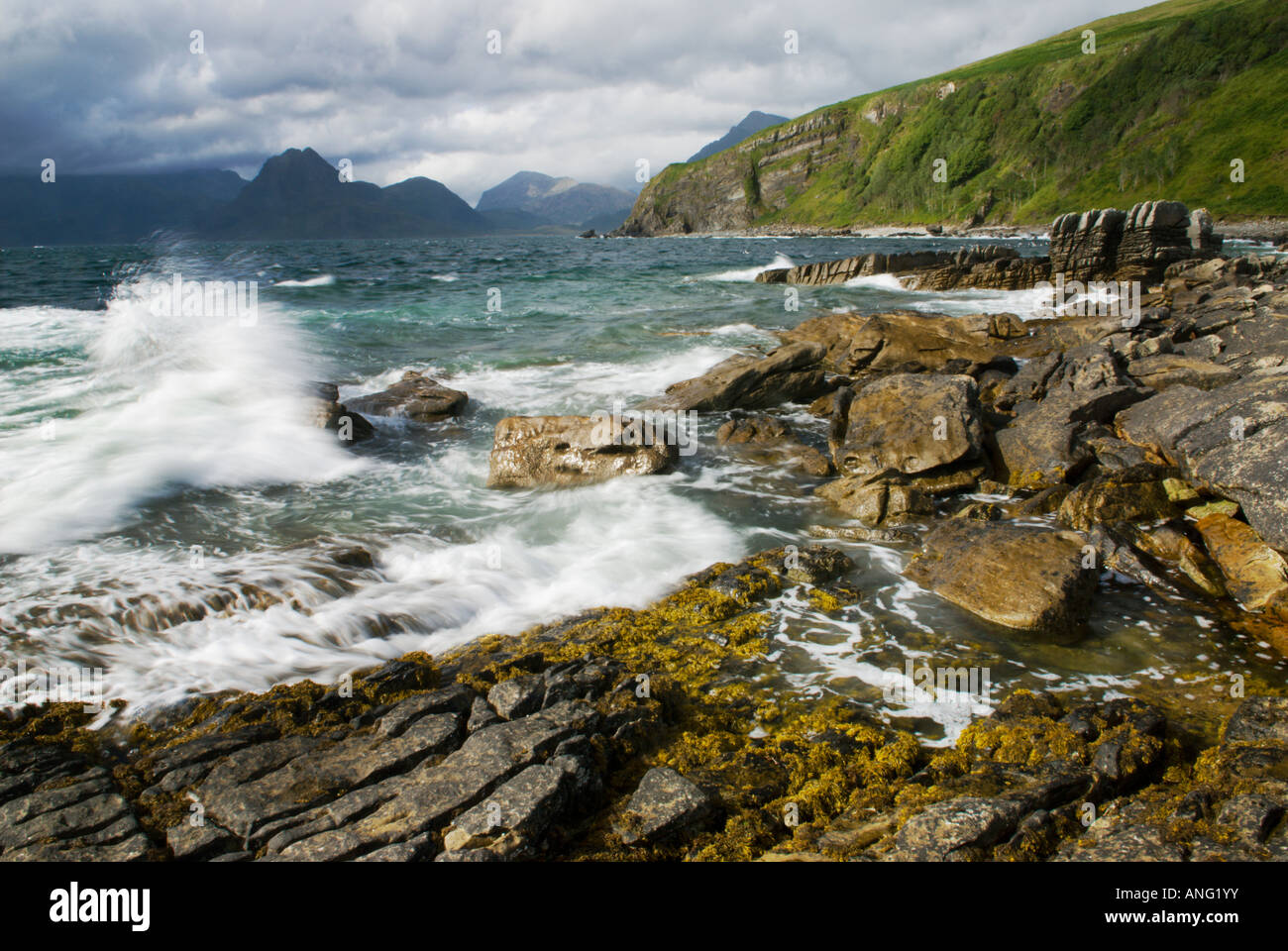Waves Sea Surf Breaking On The Shoreline The Cuilin Mountains In The ...