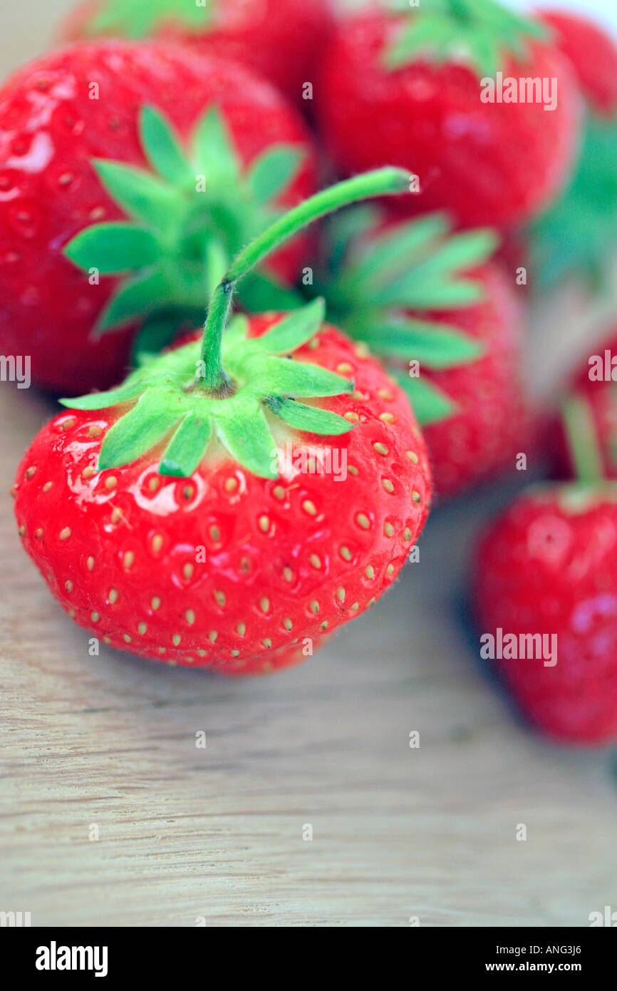 Strawberries on chopping board Stock Photo - Alamy