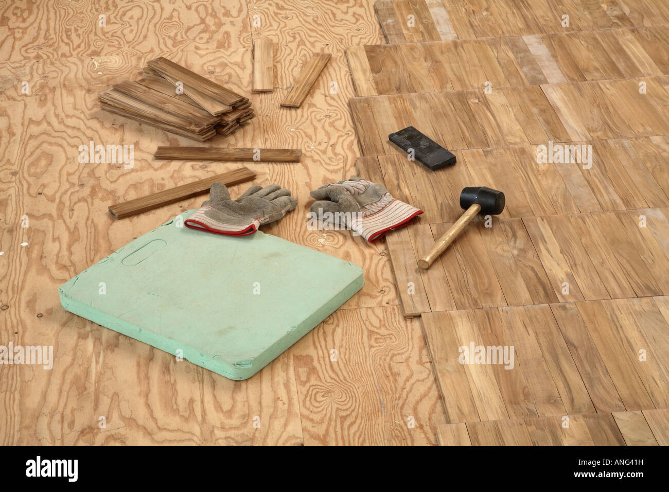 Laying a wood parquet flooring Stock Photo - Alamy