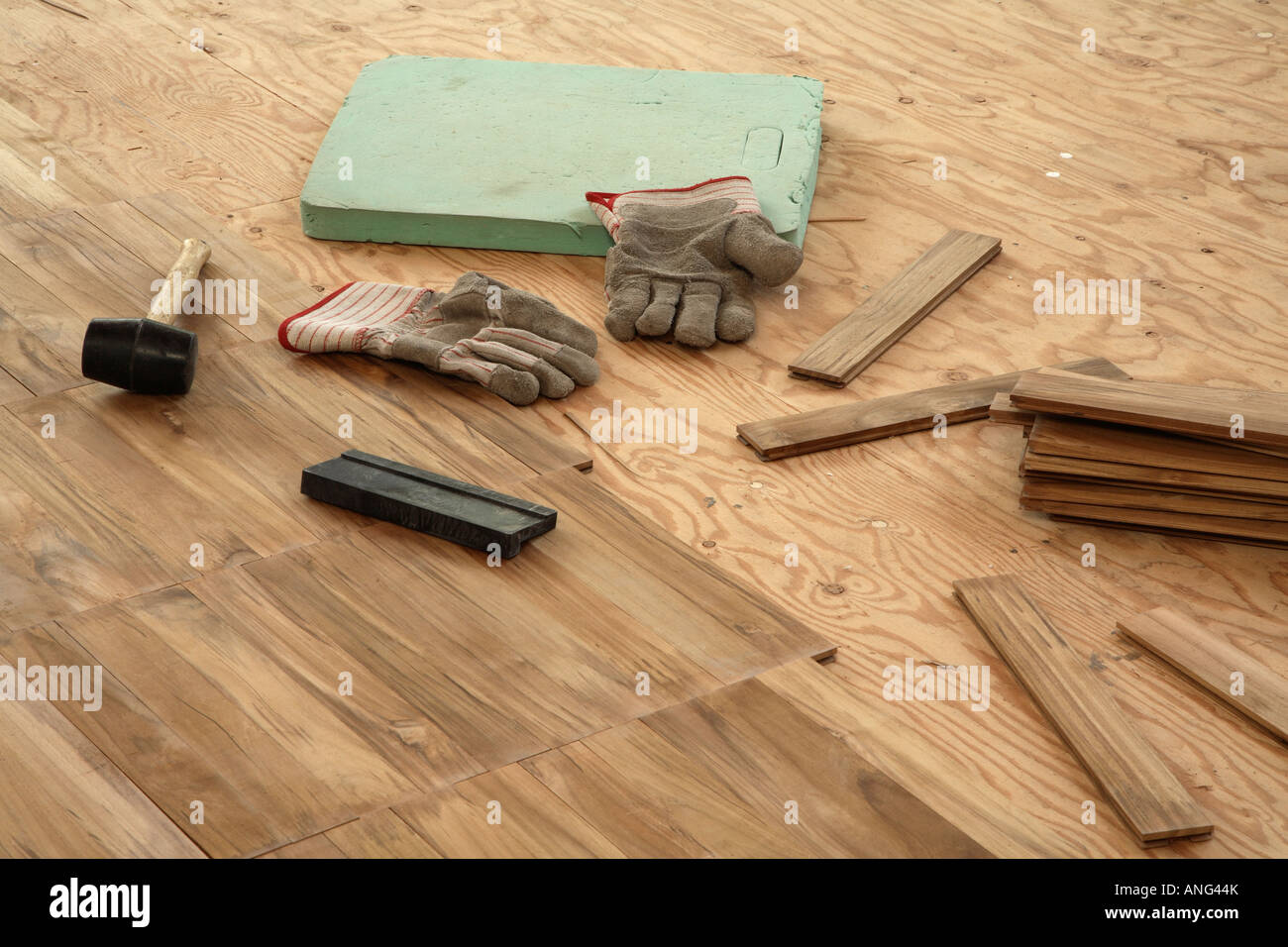 Laying a wood parquet flooring Stock Photo - Alamy