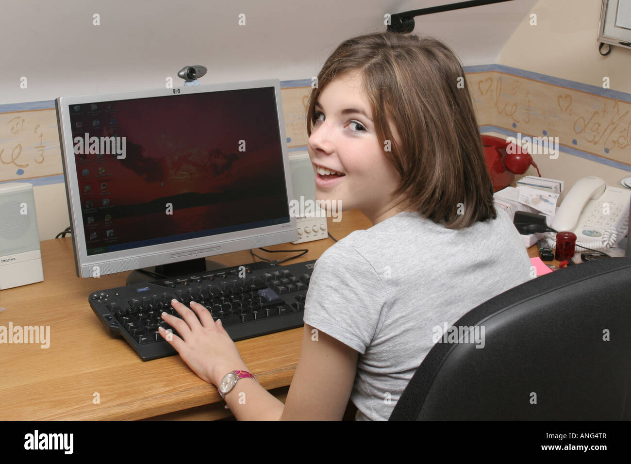 A girl working on her home PC Stock Photo - Alamy