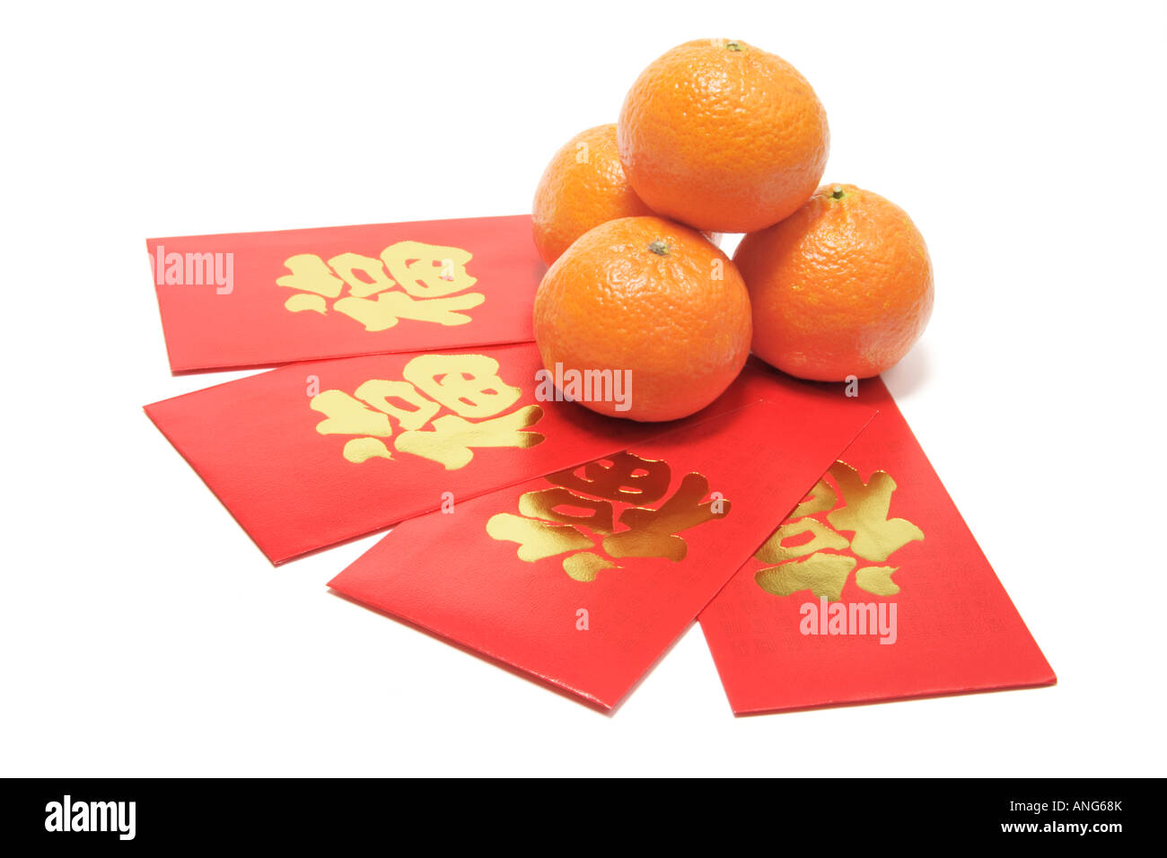 Mandarins and Red Packets Stock Photo - Alamy