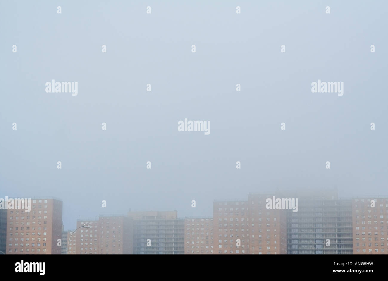 low-rise apartment buildings in a dense fog Stock Photo - Alamy