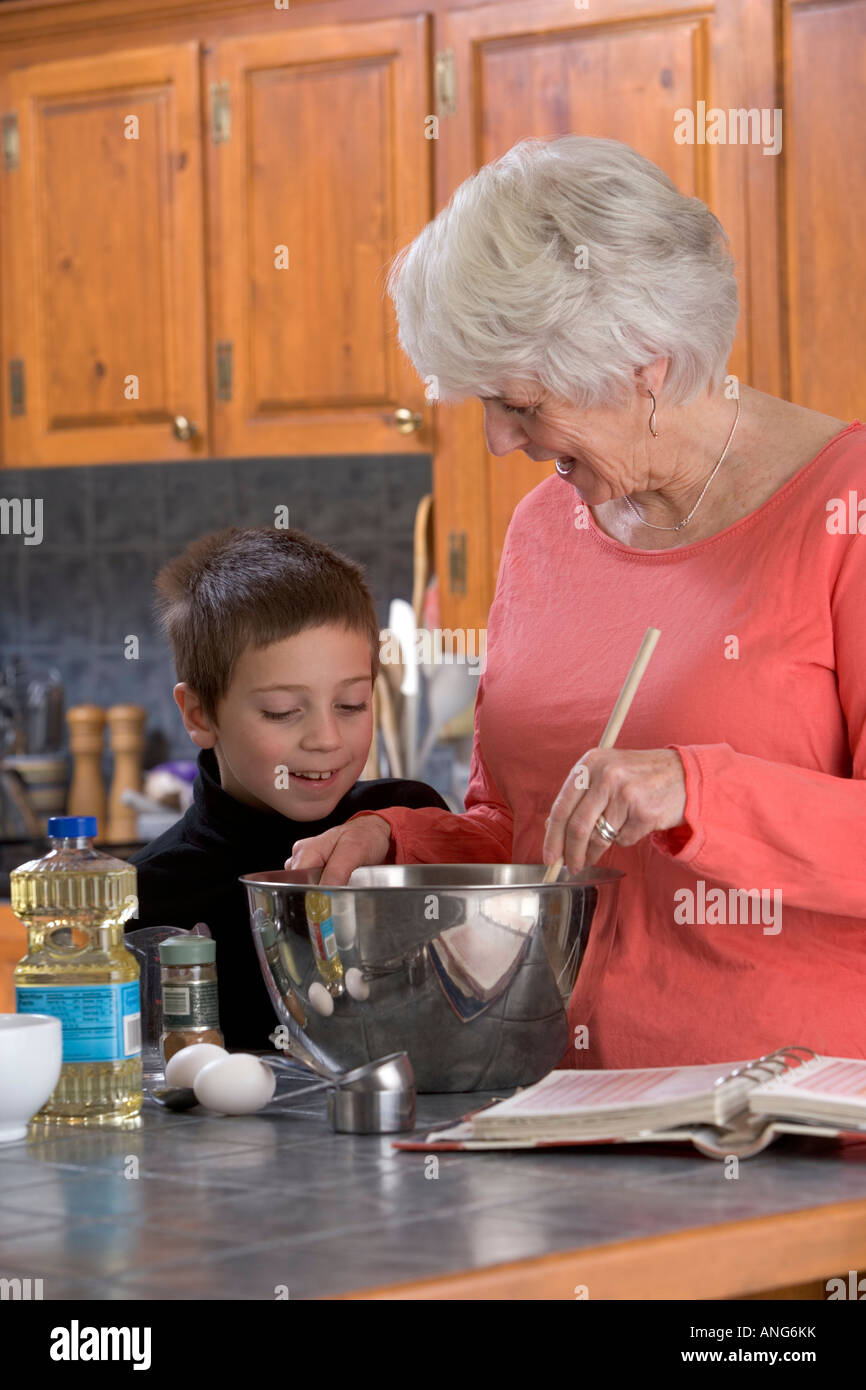 Grandmother cooking with her grandson Stock Photo - Alamy