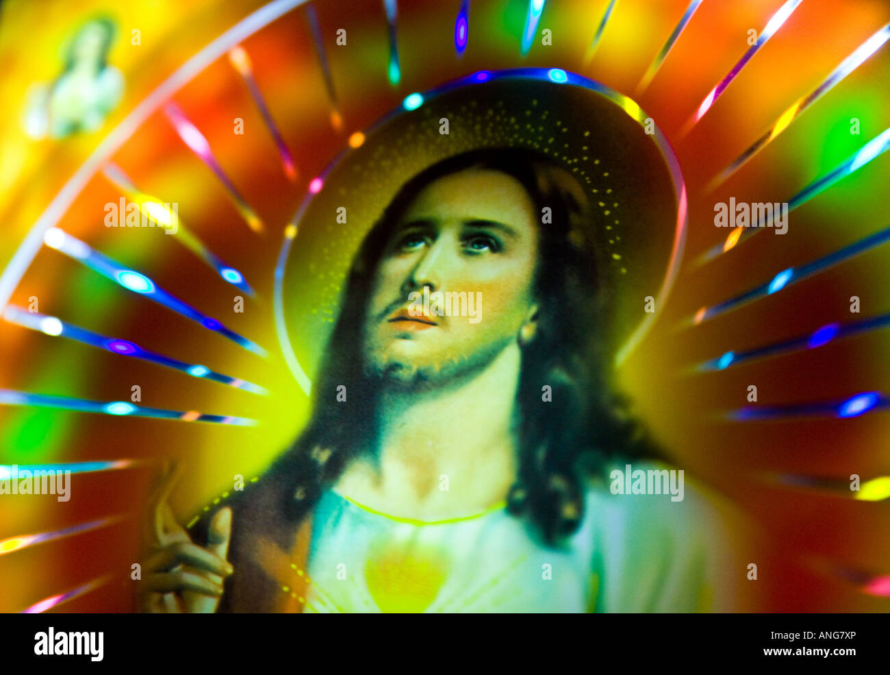 artwork of Jesus illuminated by colorful lights Stock Photo - Alamy