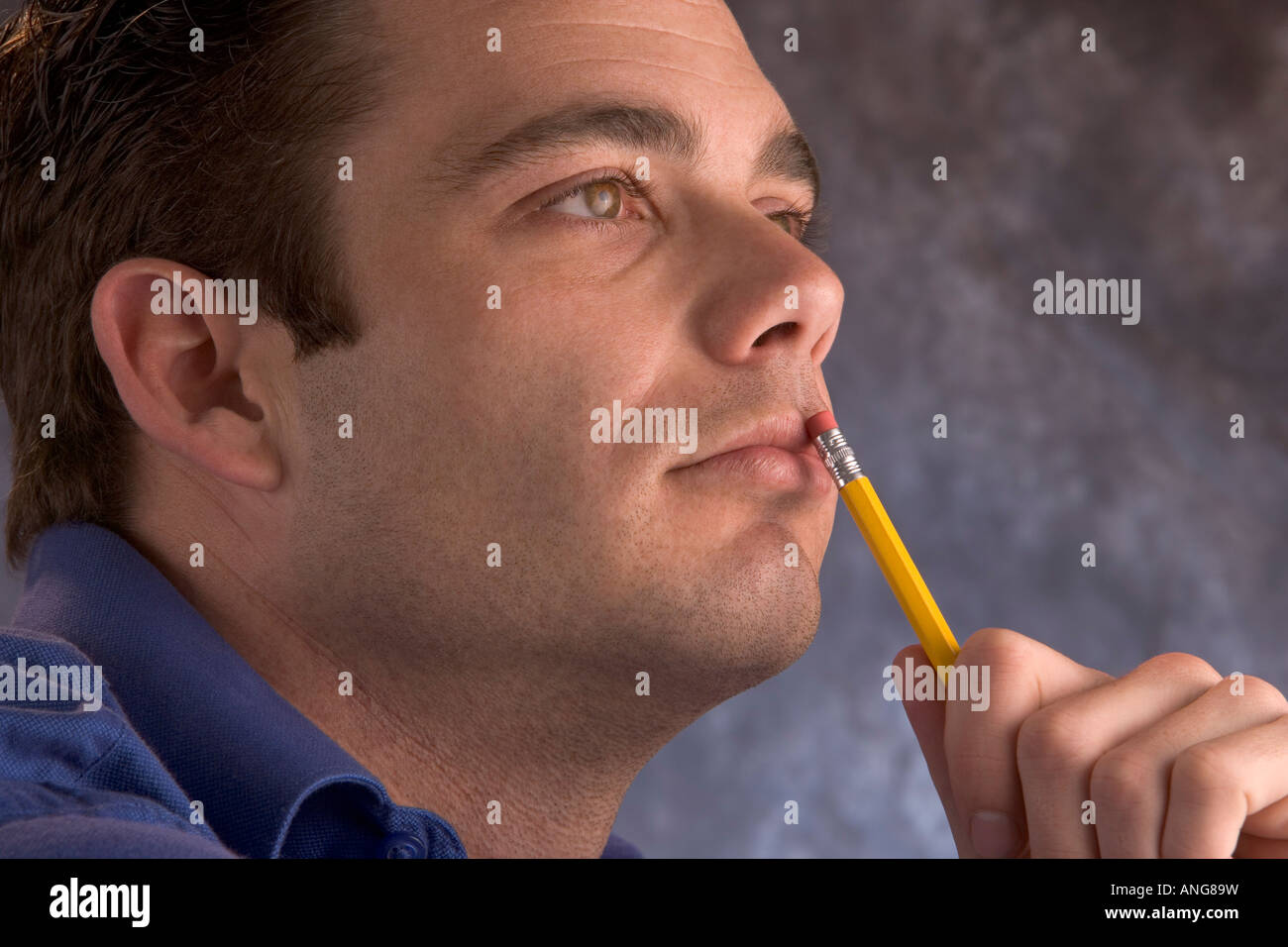 Man thinking writing listening to a lecture Stock Photo - Alamy