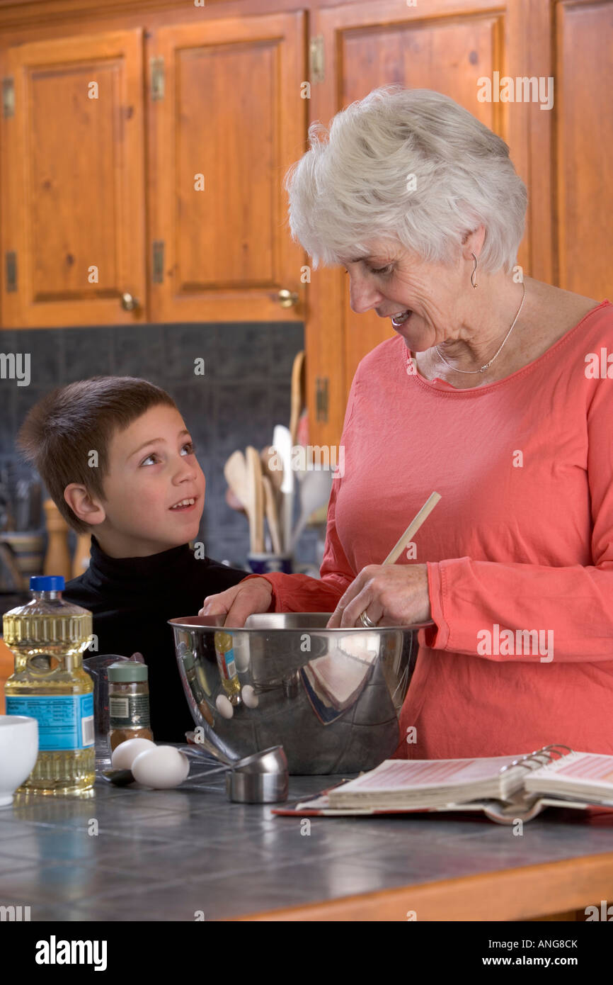Grandmother cooking with her grandson Stock Photo - Alamy