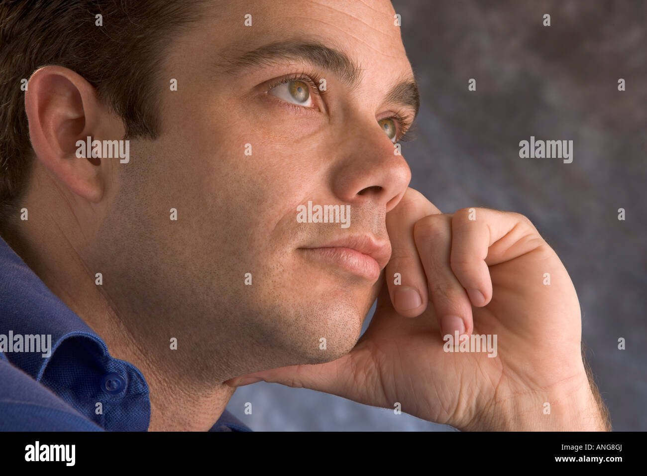 A man listening watching a presentation or thinking Stock Photo - Alamy