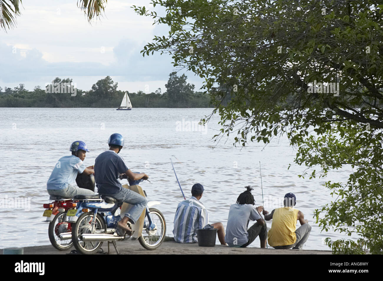 Local residents of mixed descent African and Javanese on the shore of ...