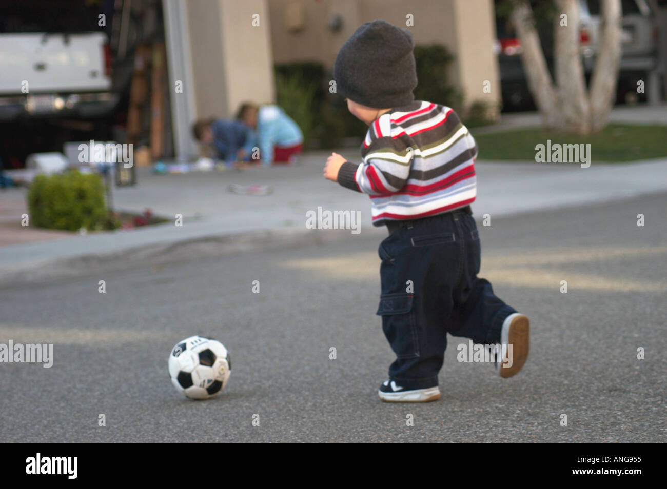 toddler chasing ball Stock Photo - Alamy