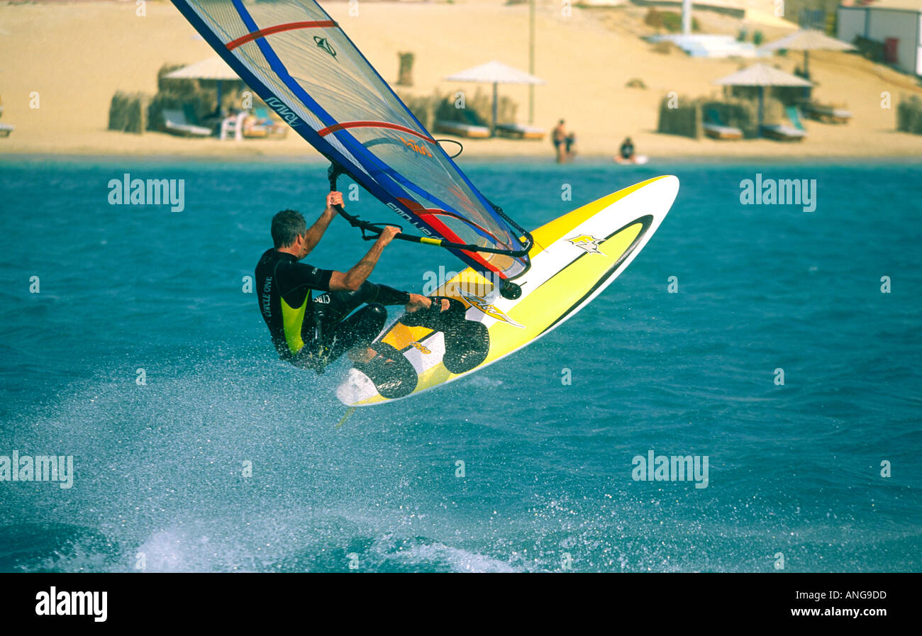 windsurfer jumping off light blue chop wave Red Sea Sinai Egypt Stock ...