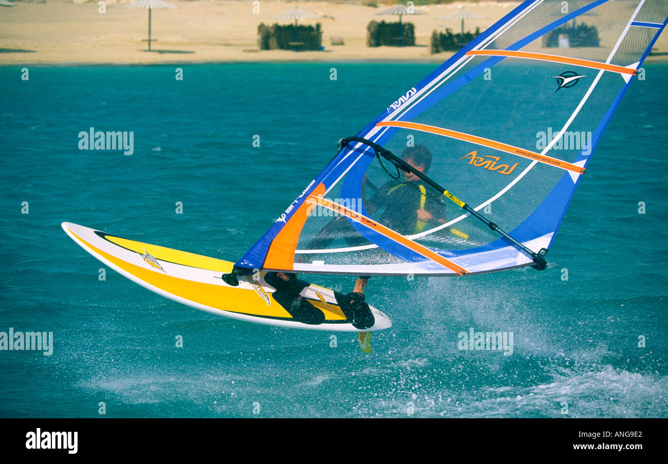 windsurfer jumping off light blue chop wave Red Sea Sinai Egypt Stock ...
