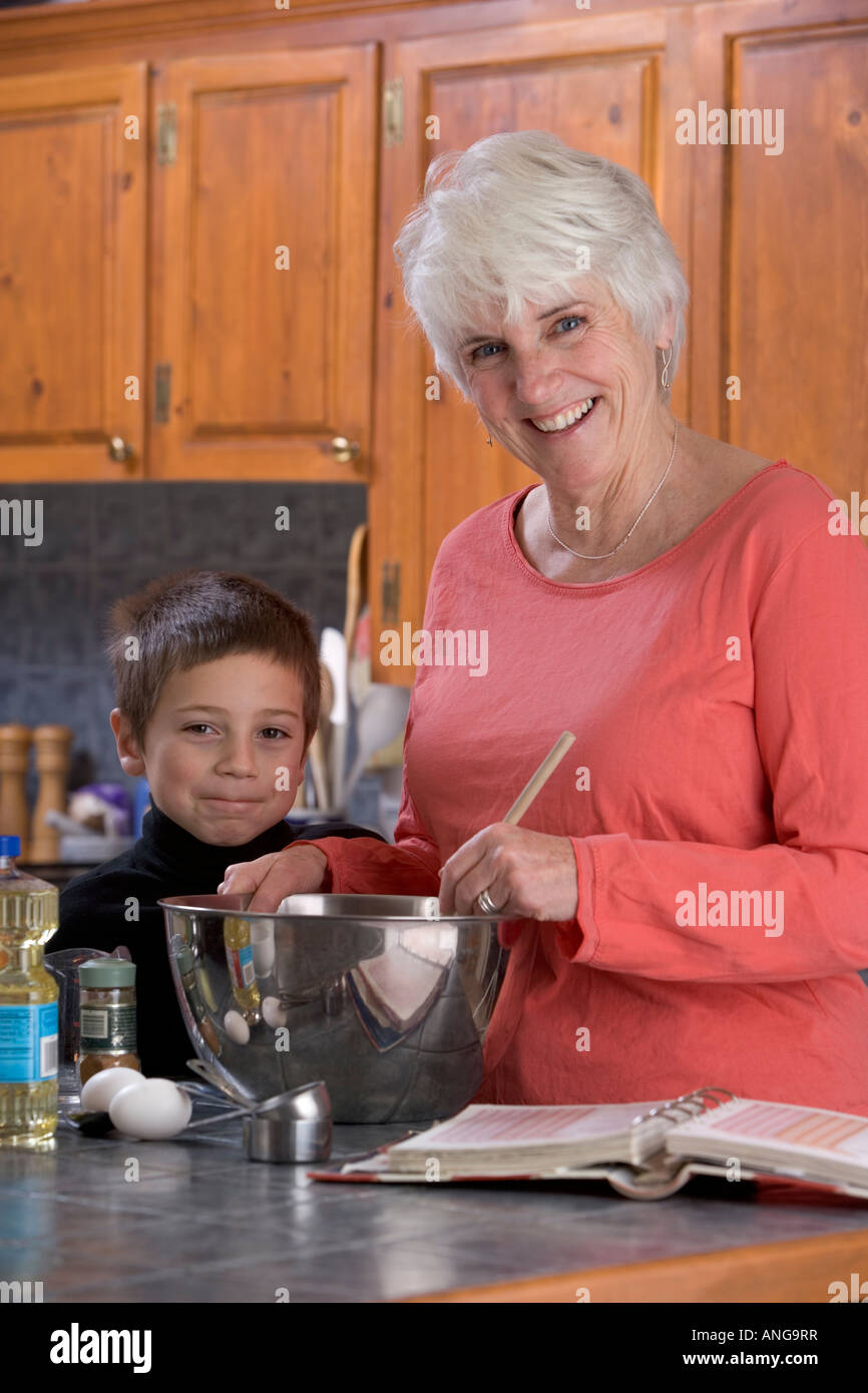 Grandmother cooking with her grandson Stock Photo - Alamy