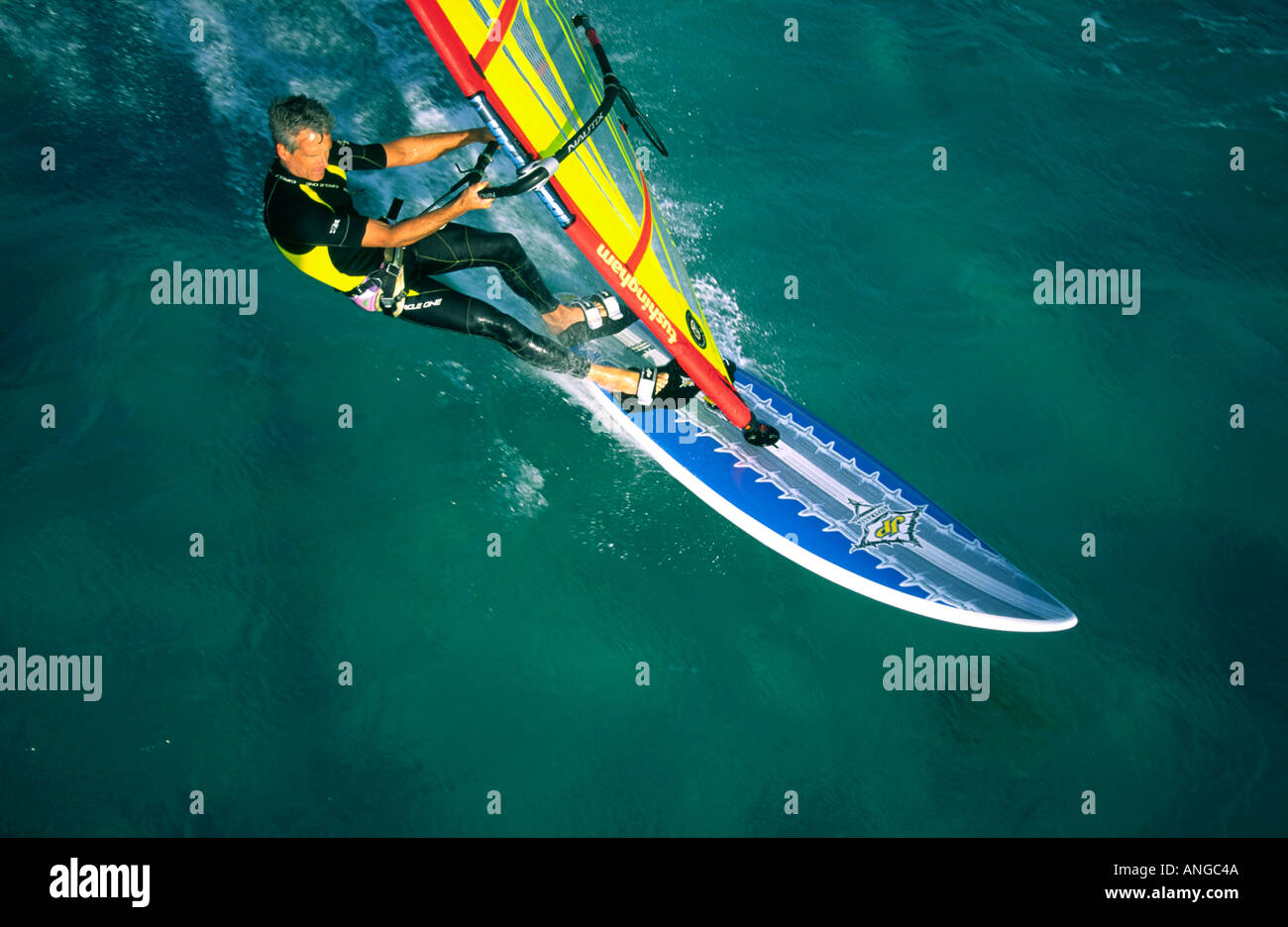 aerial view of single male windsurfer sailing on azure water of Red Sea ...
