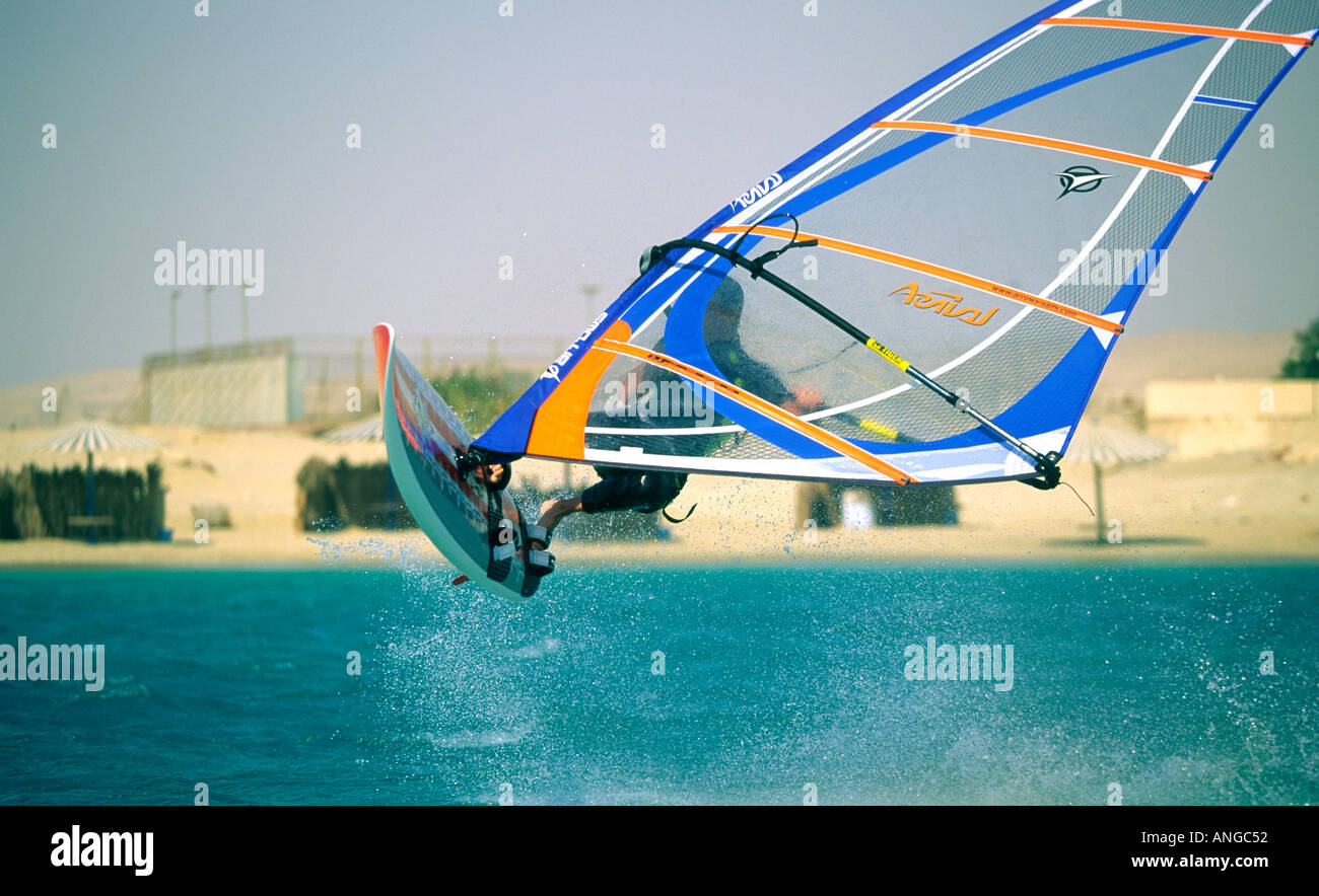 single male windsurfer jumping on chop waves Red Sea Sinai Egypt Stock ...