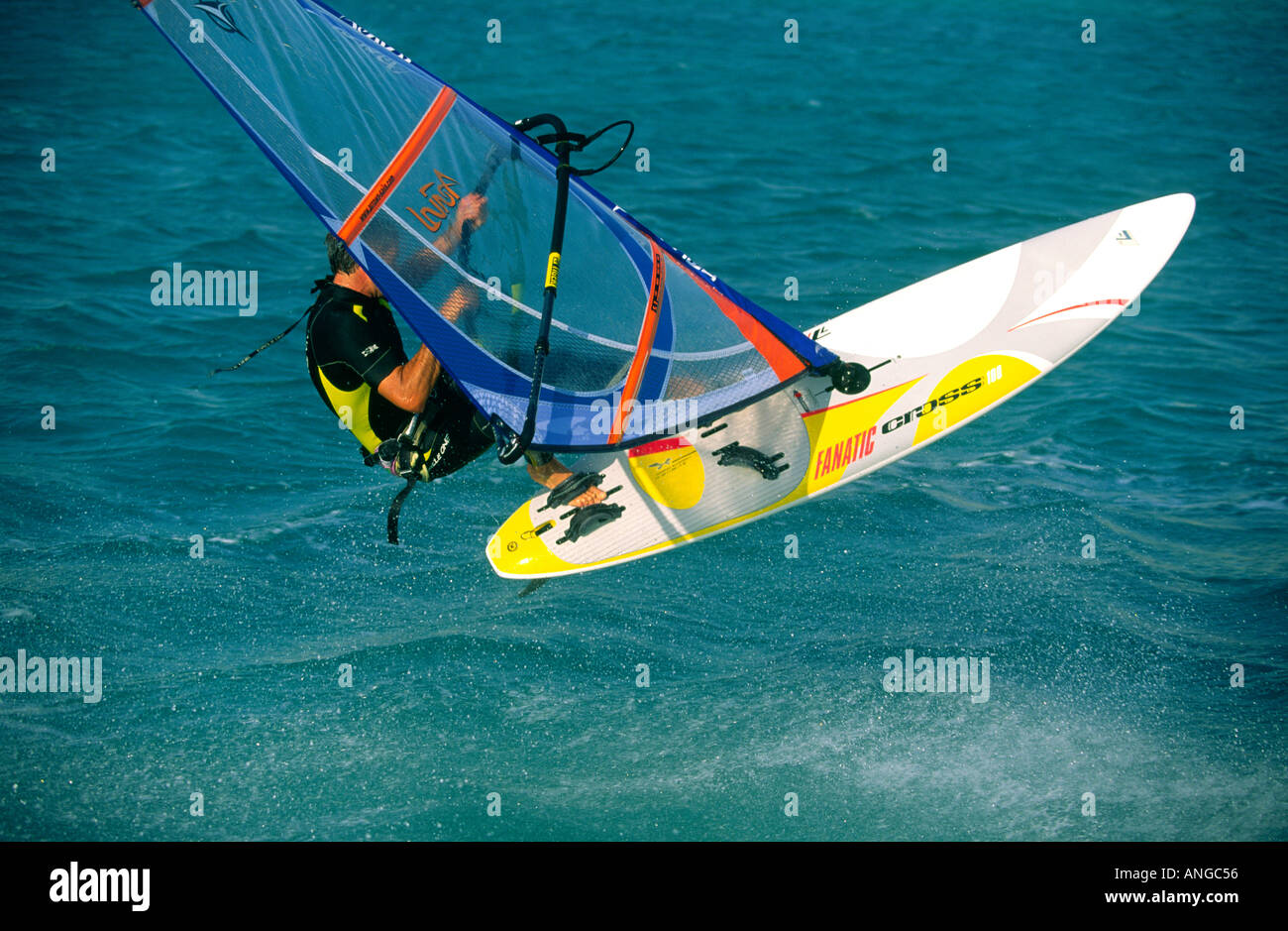 single male windsurfer jumping on chop waves Red Sea Sinai Egypt Stock ...