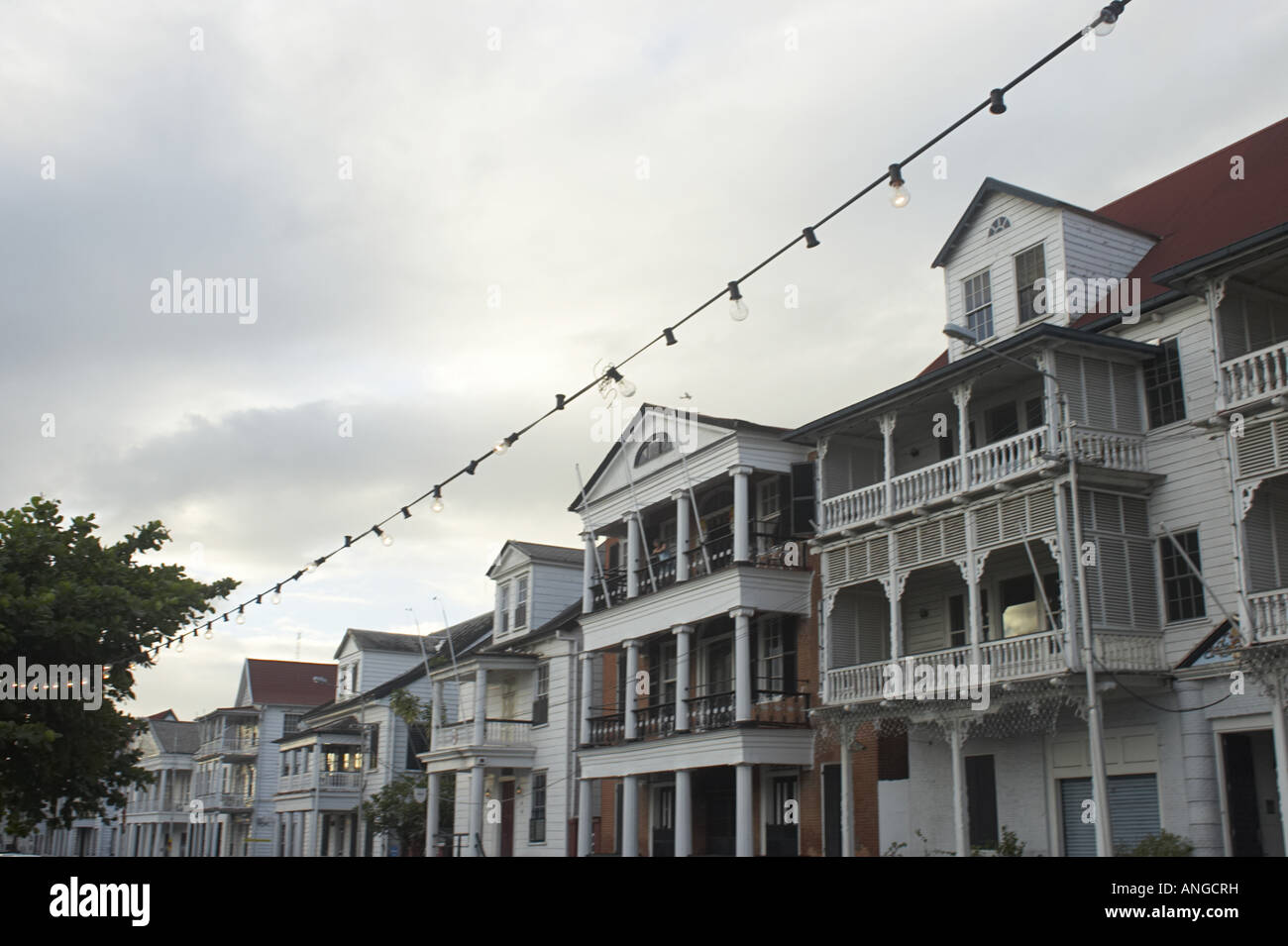 Street lined with old Colonial houses in the capital city of Paramaribo ...