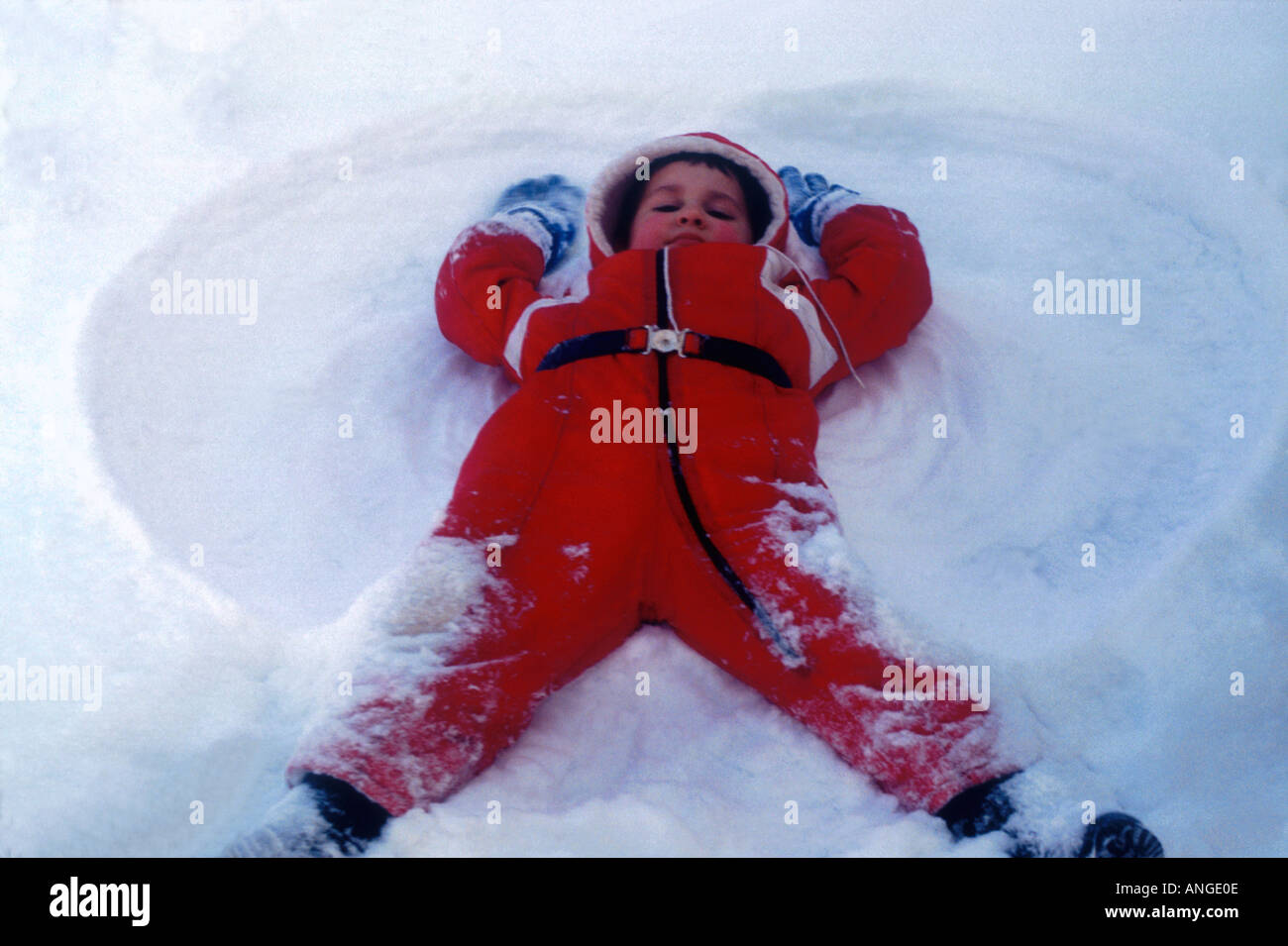 Boy making a snow angel hi-res stock photography and images - Alamy