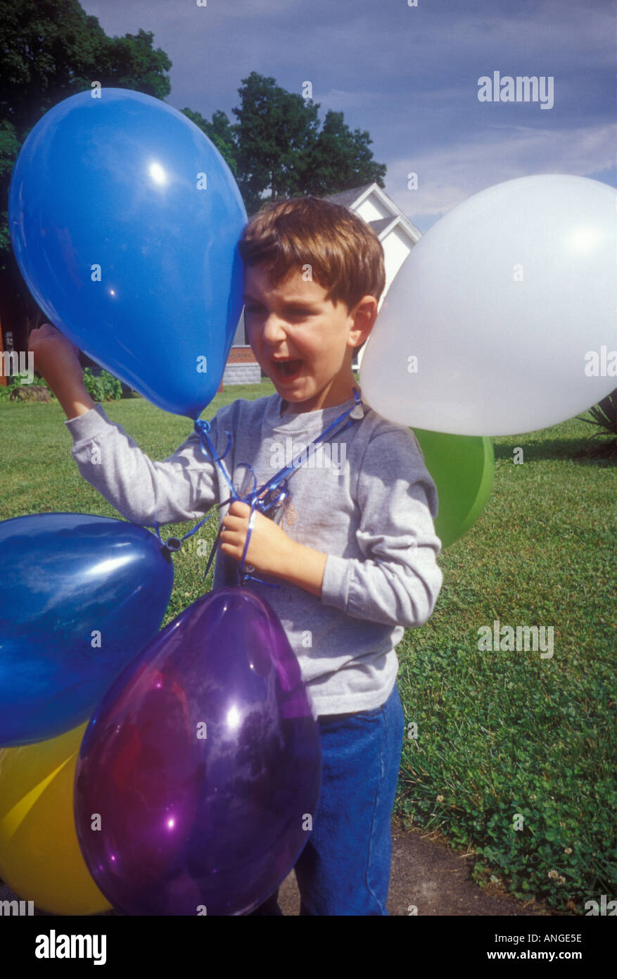 Boy with Balloons Stock Photo - Alamy