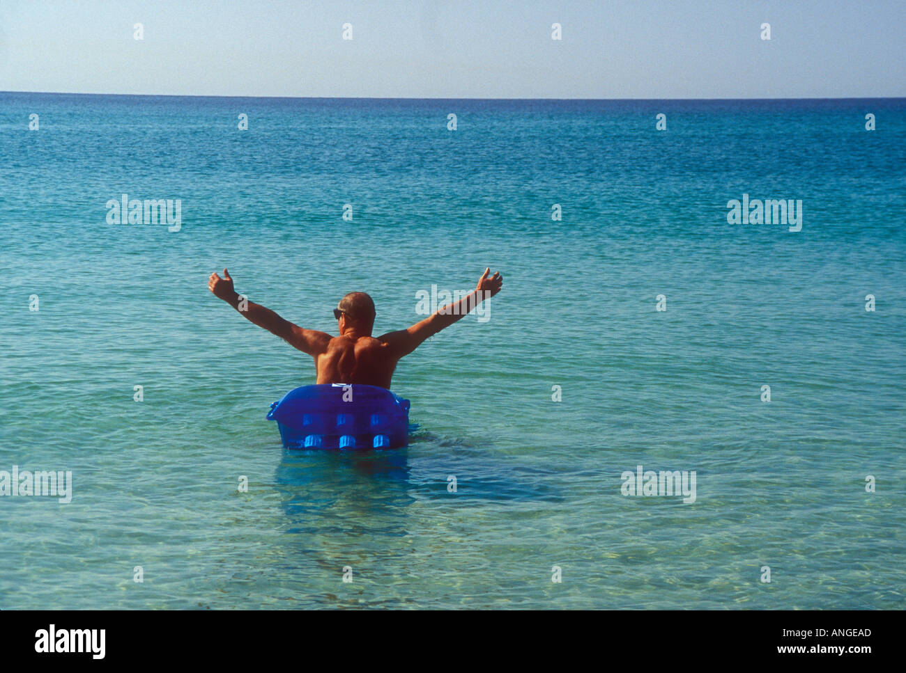 Man rest on floating mattress hi-res stock photography and images - Alamy