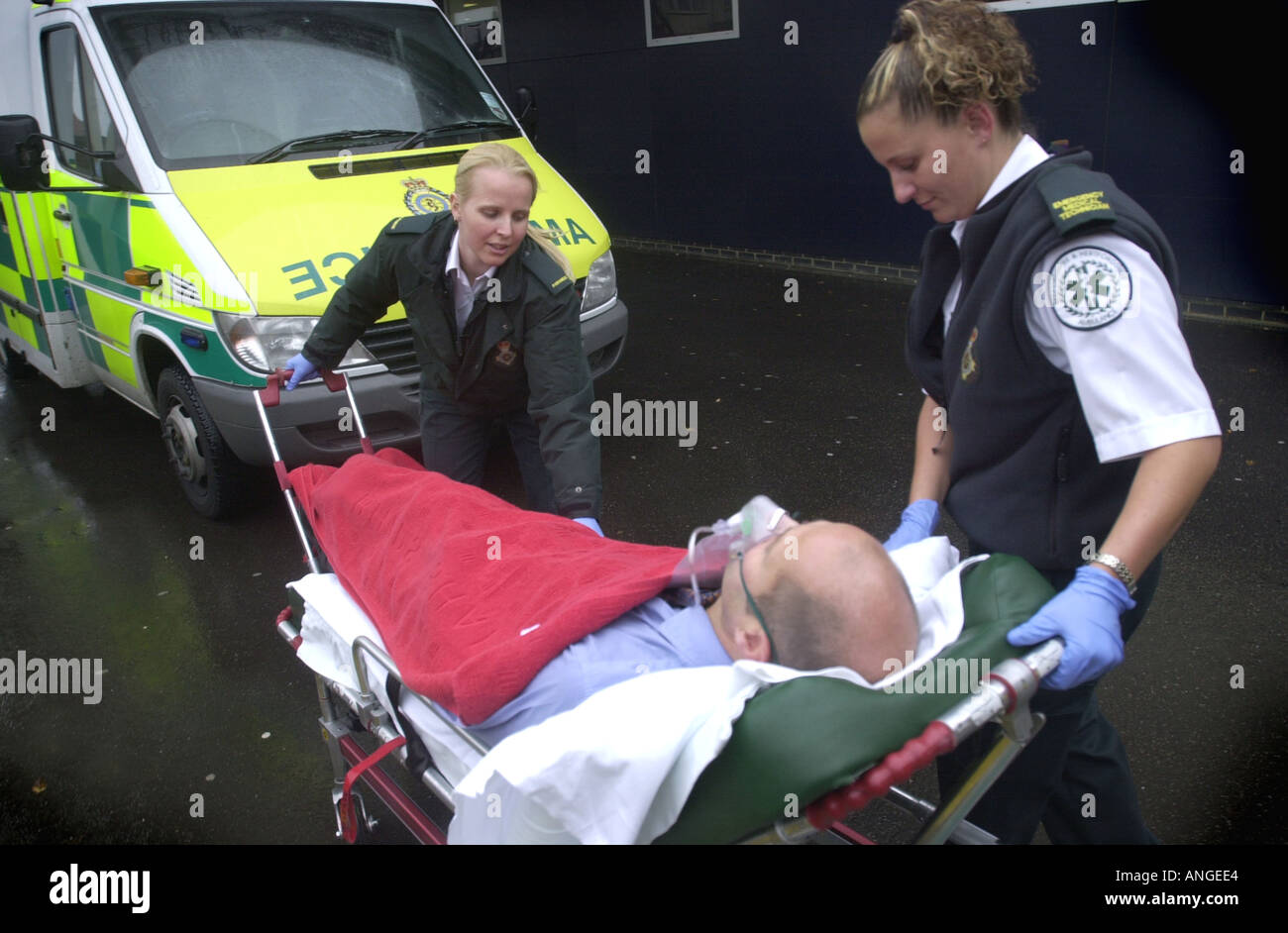 Ambulance crew escort a patient into Accident and Emergency UK Stock ...