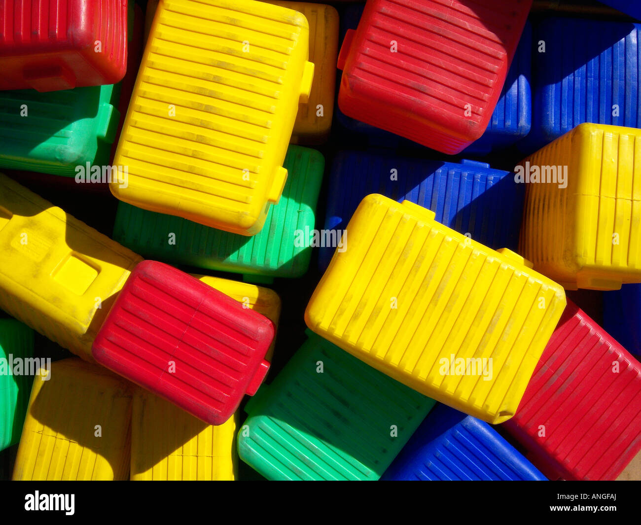 multicolor plastic boxes floating in pool water. Photo by Willy ...