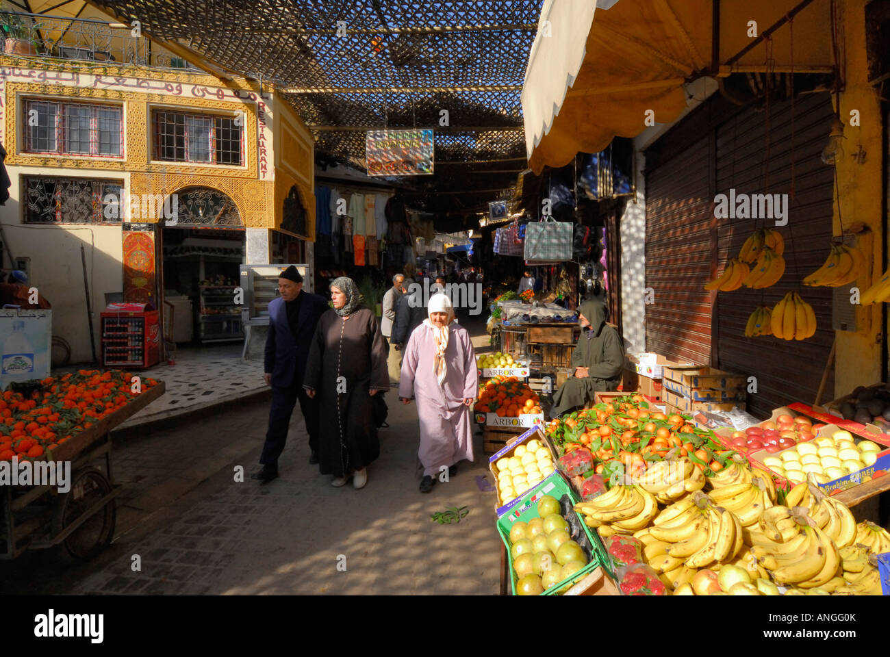 People shopping at the Fruit market, Fez Medina, Morocco Stock Photo ...