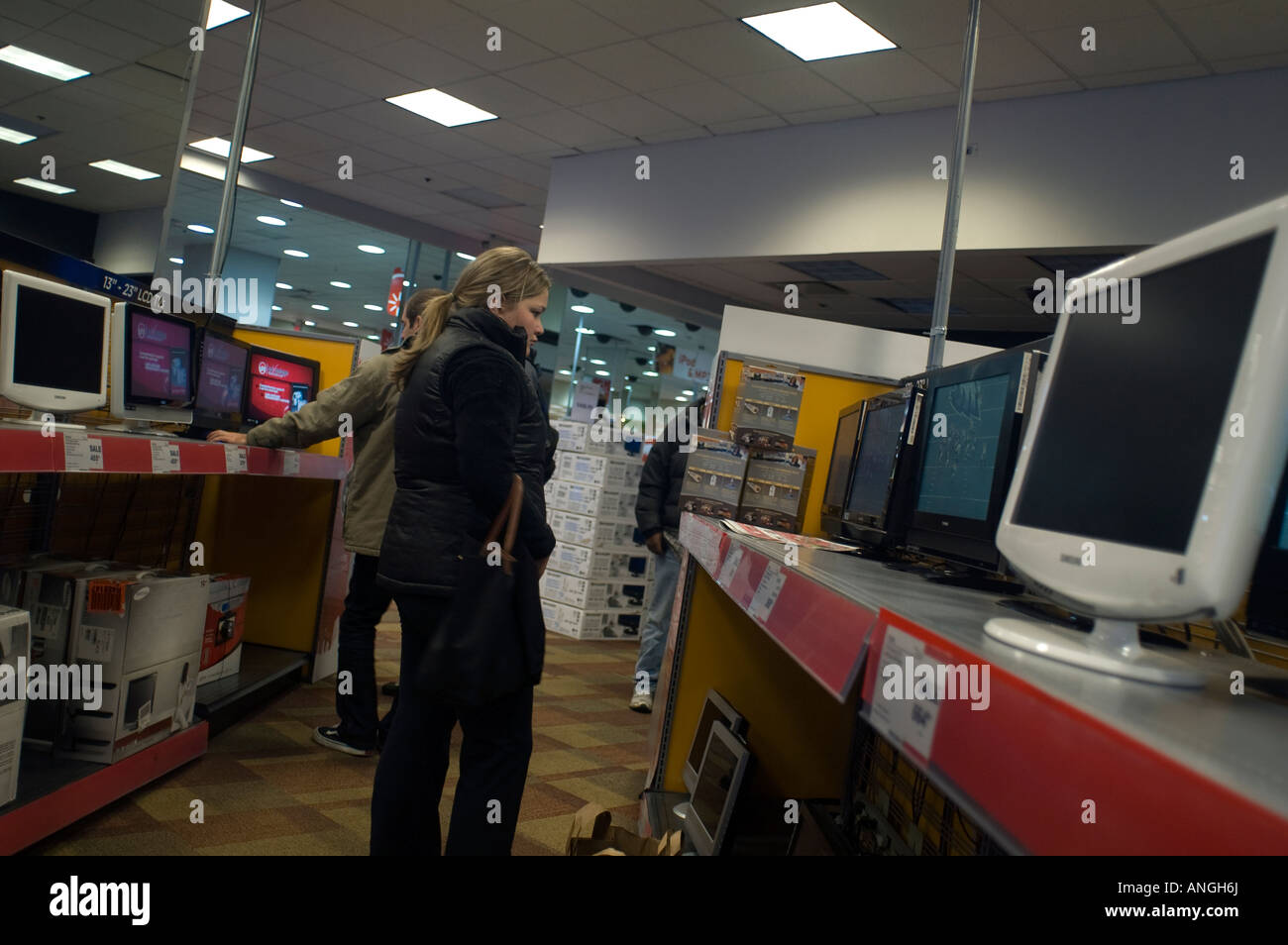 Customers browse in the television department at Circuit City ...