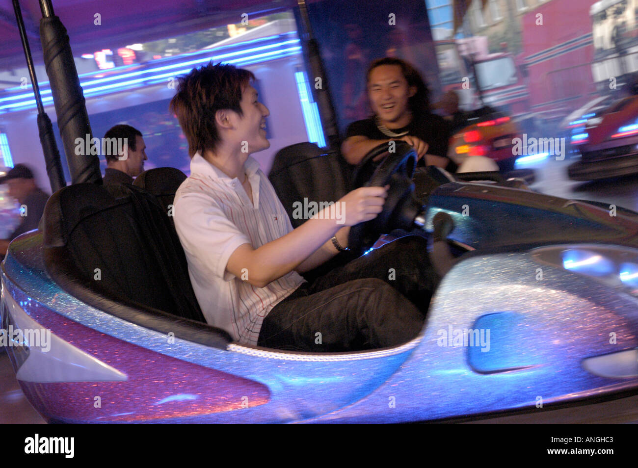 Kids having fun on fairground rides hi-res stock photography and images ...