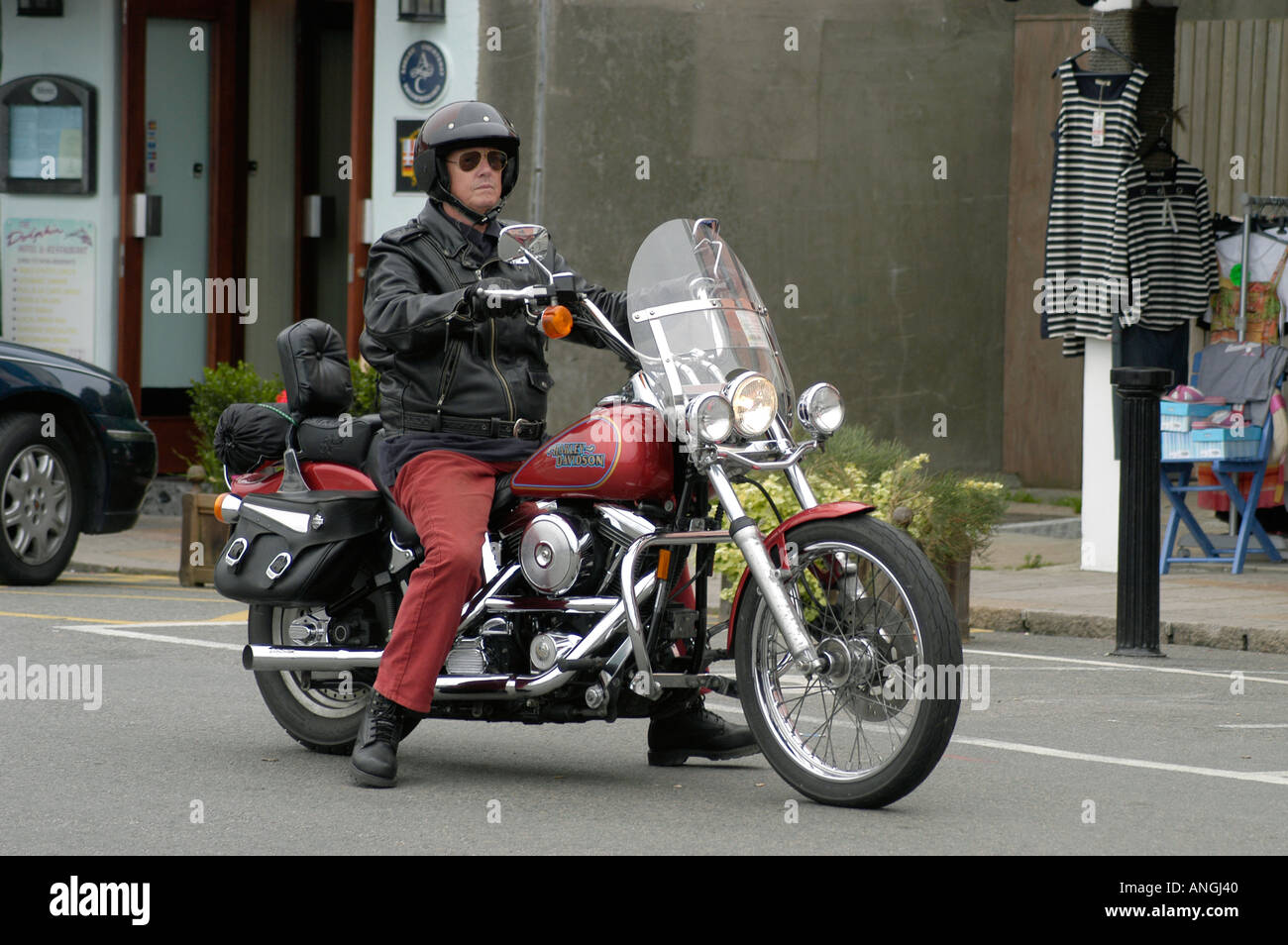 man riding Harley Davidson motorcycle Stock Photo - Alamy