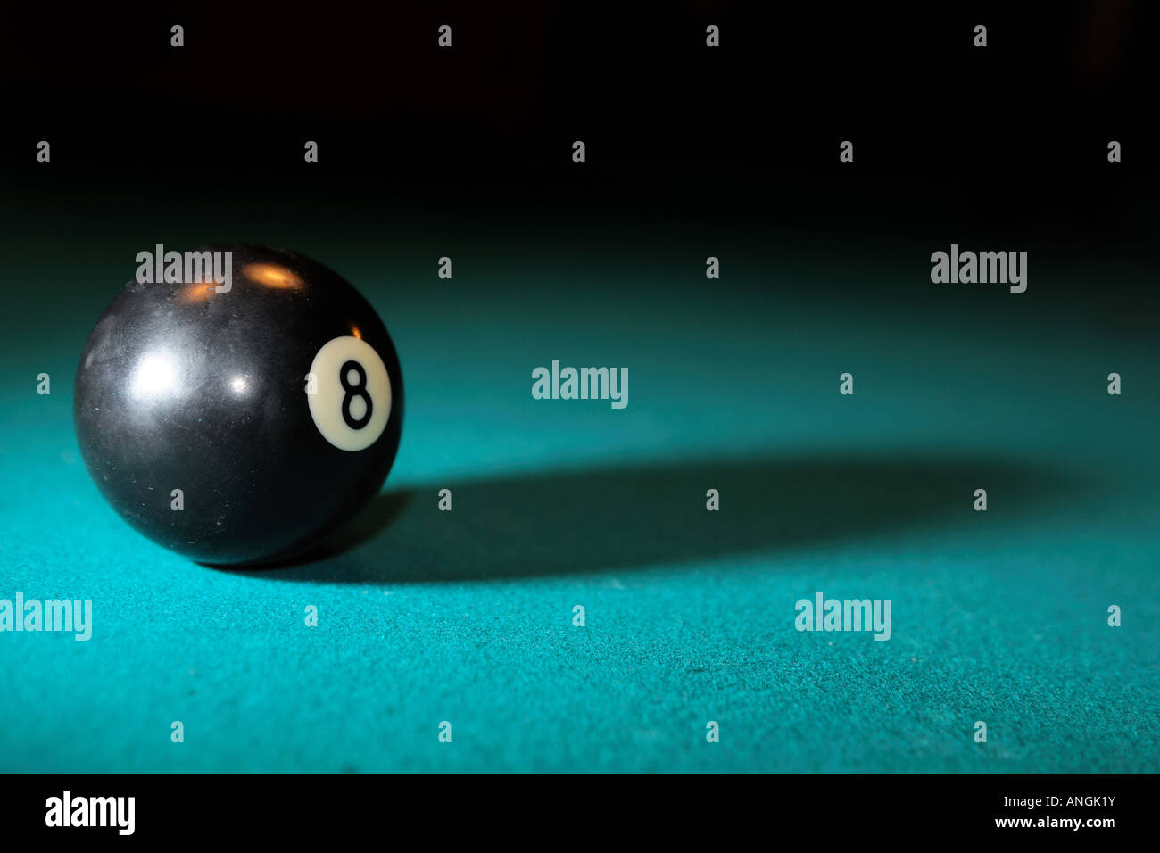 black eight ball on green pool table Stock Photo - Alamy