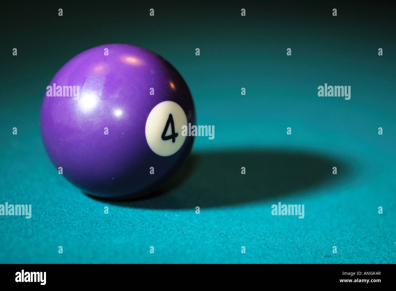 purple four ball on green pool table Stock Photo - Alamy
