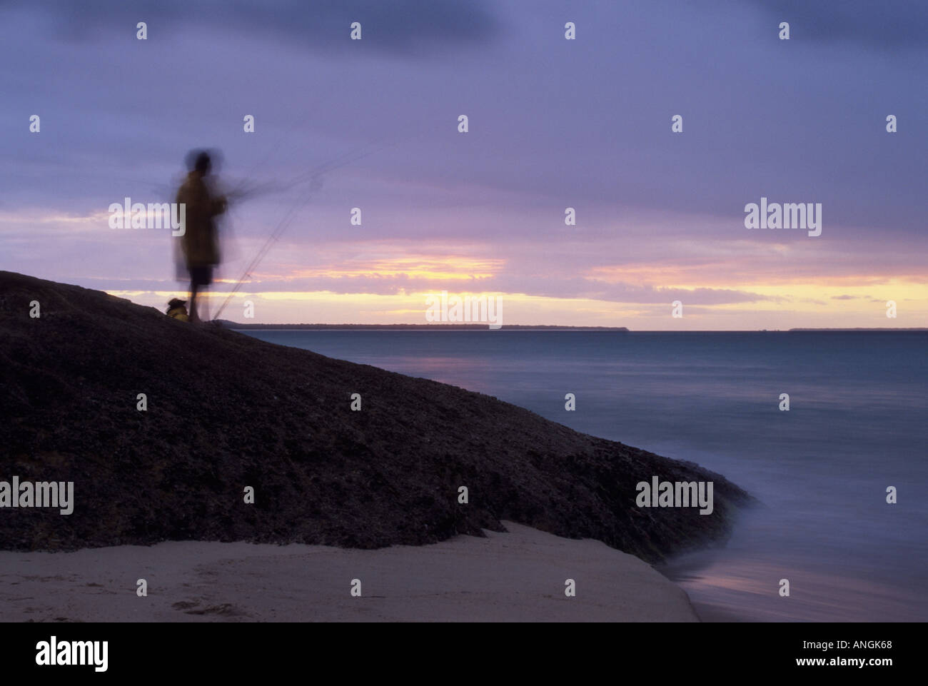 Fisherman at sunset, North Stradbroke Island, Australia Stock Photo - Alamy