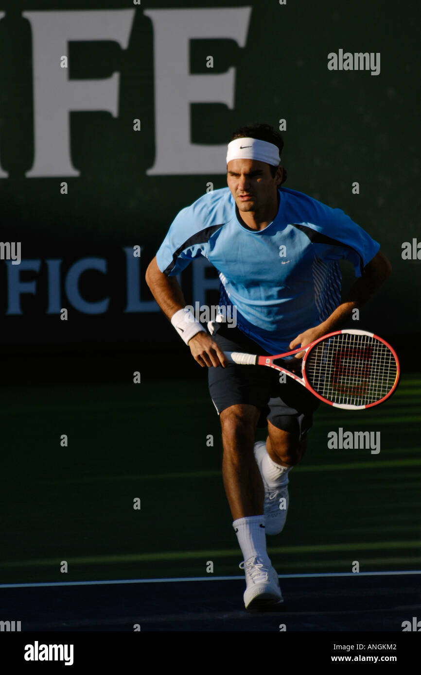 Roger Federer approaches the net in a rare doubles appearance at the ...