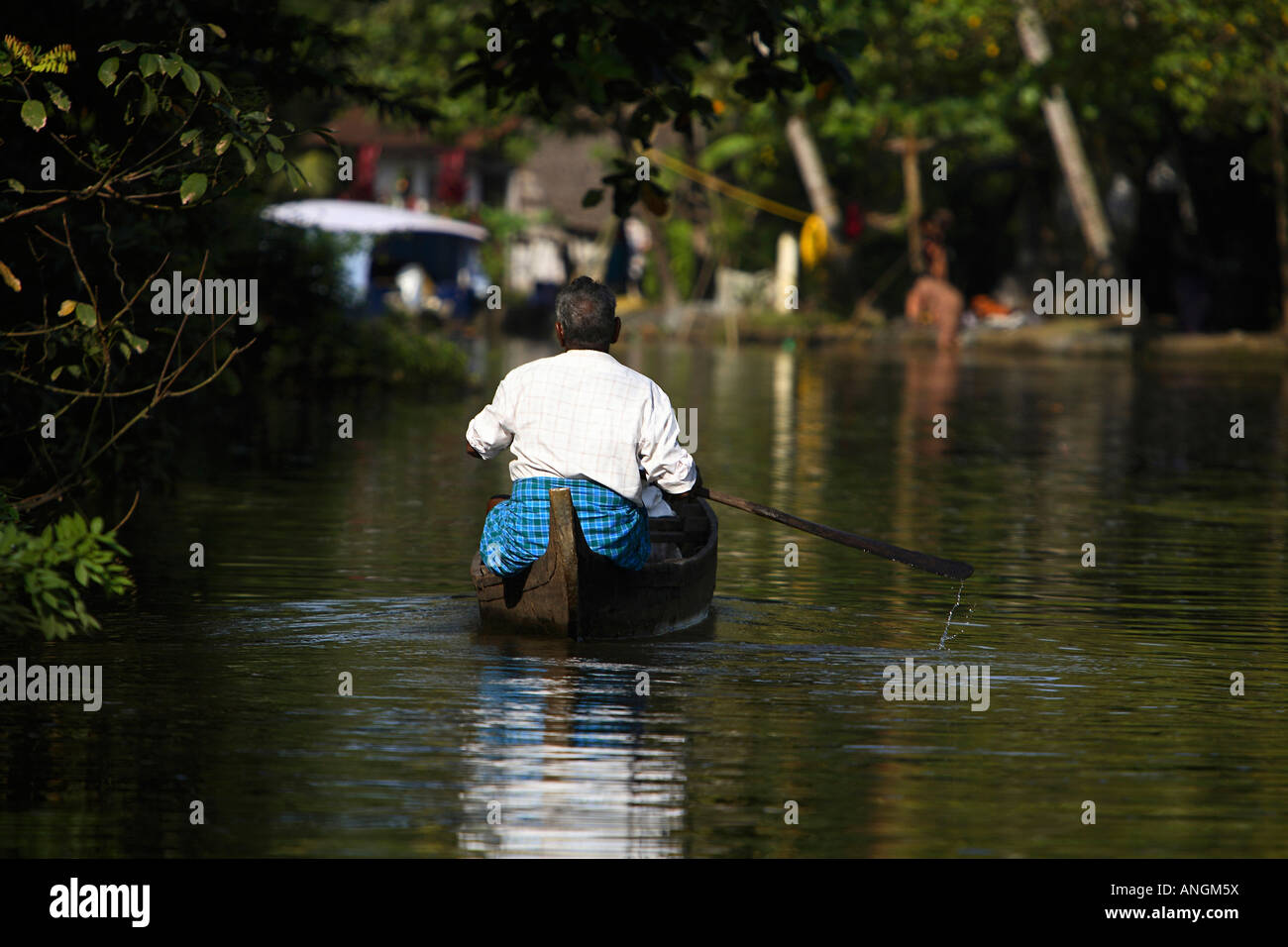 A man Sailing a Country Boat from the Backwater Cannal, Kerela Stock ...