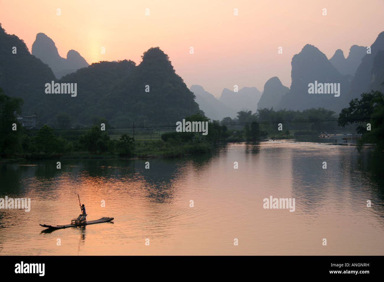 Bamboo raft on Li River near Yangshuo China at sunset Stock Photo - Alamy