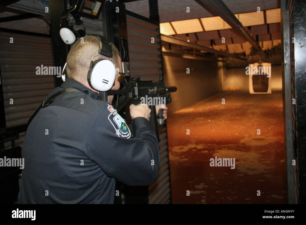 Police officer on target practice shooting on firing range Stock Photo ...