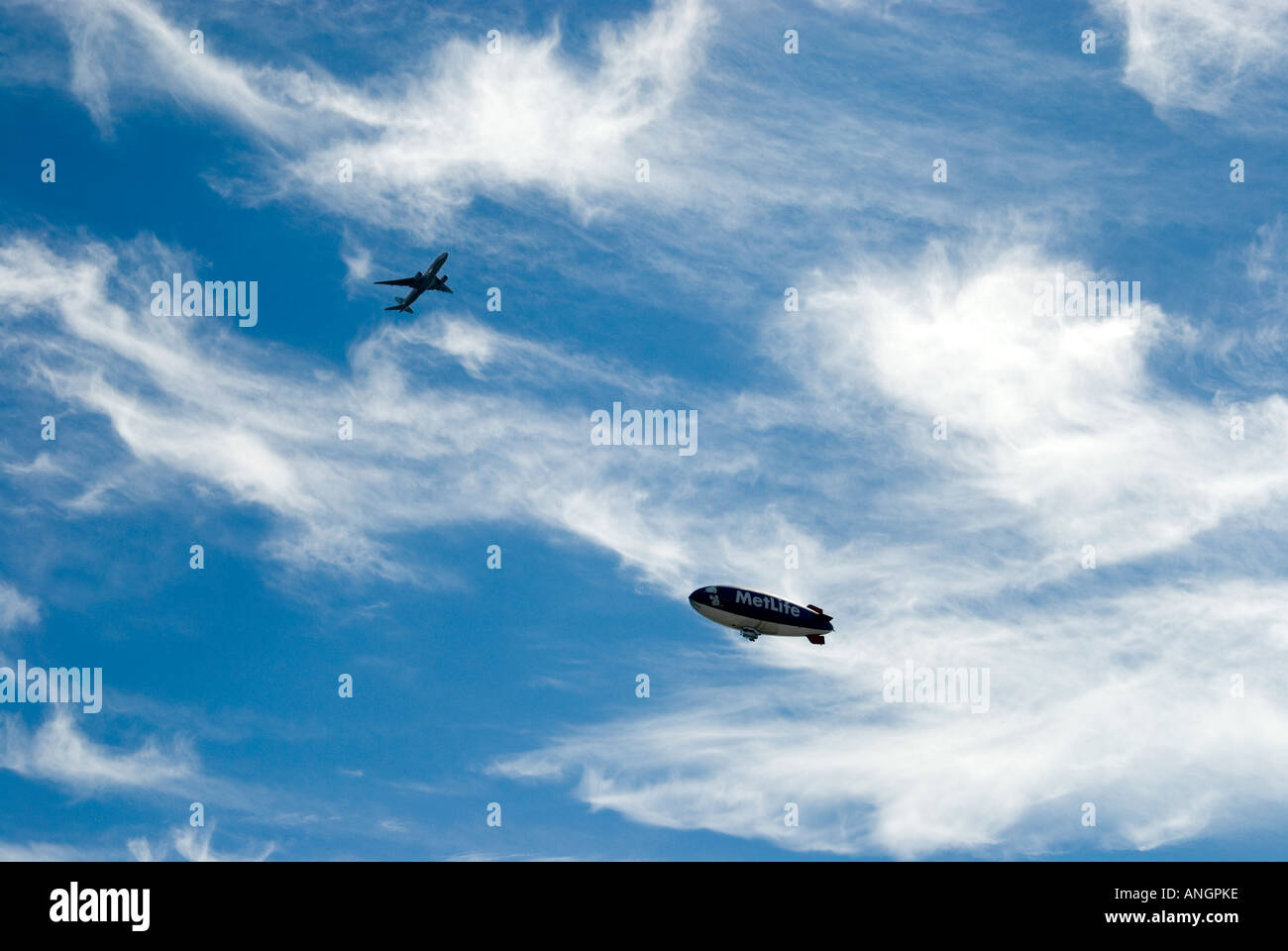 Clouds, Blimp, & Plane Stock Photo - Alamy