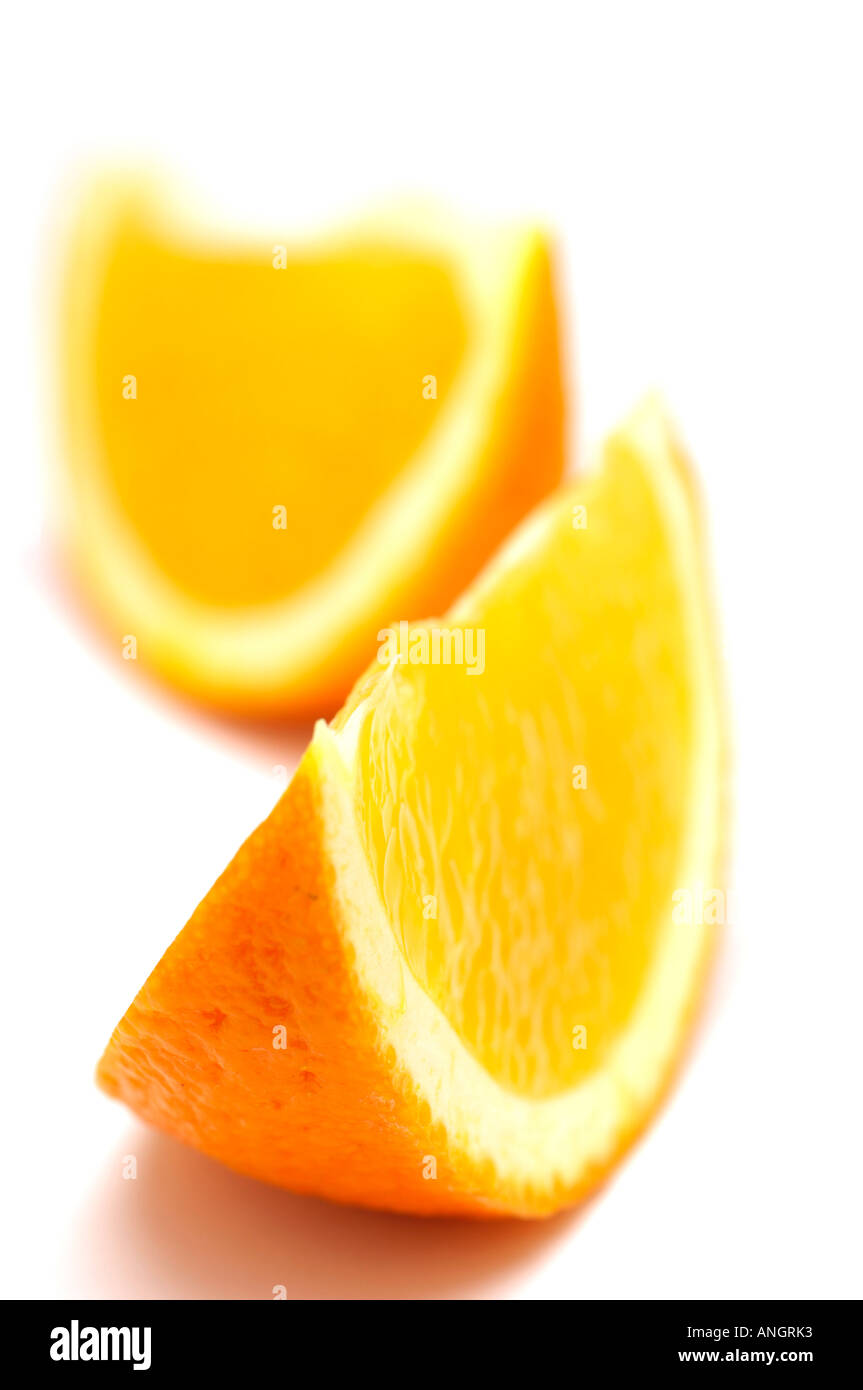 Orange segments on white background Stock Photo - Alamy