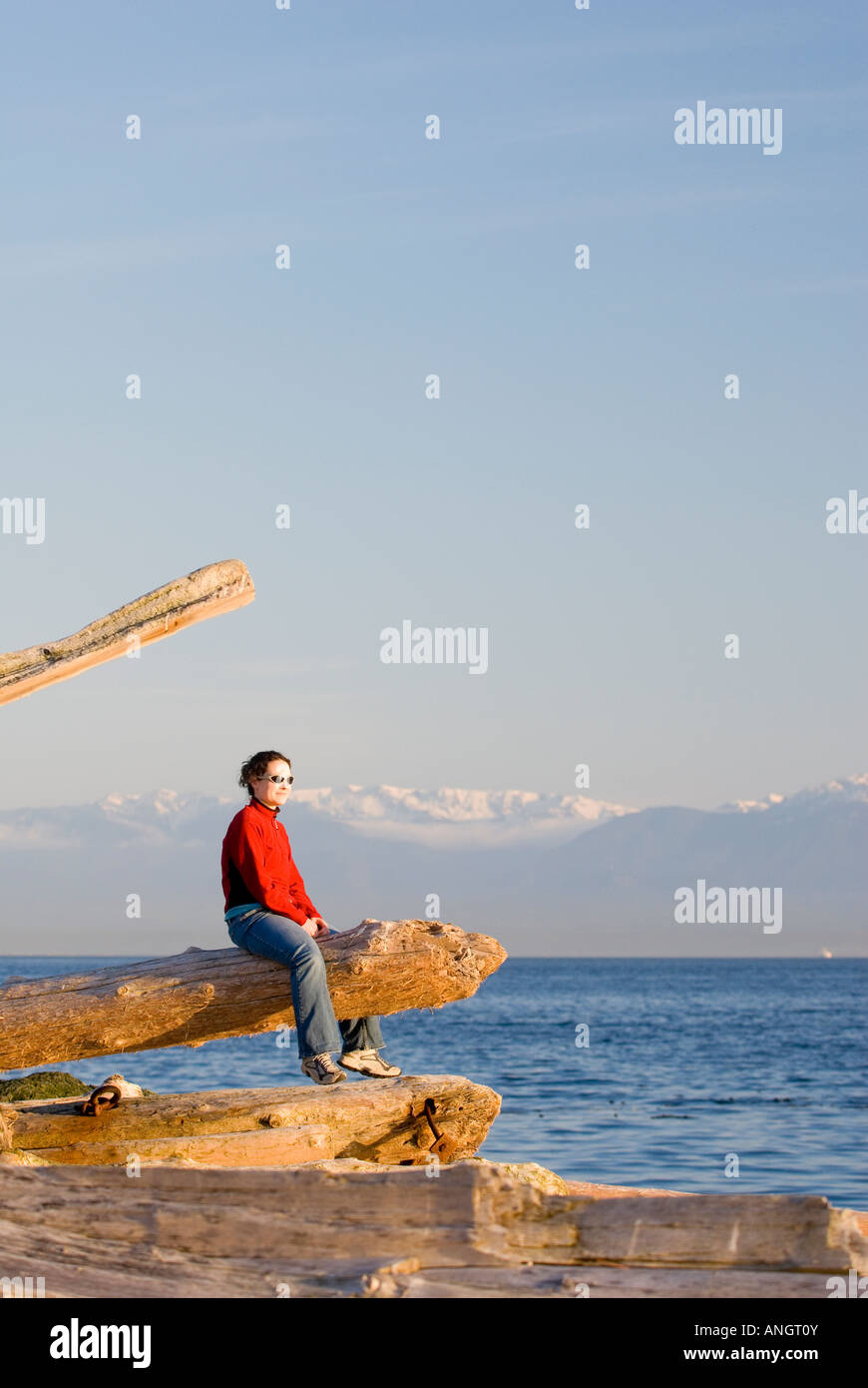 A woman enjoying the view along the Dallas Road waterfront in Victoria ...