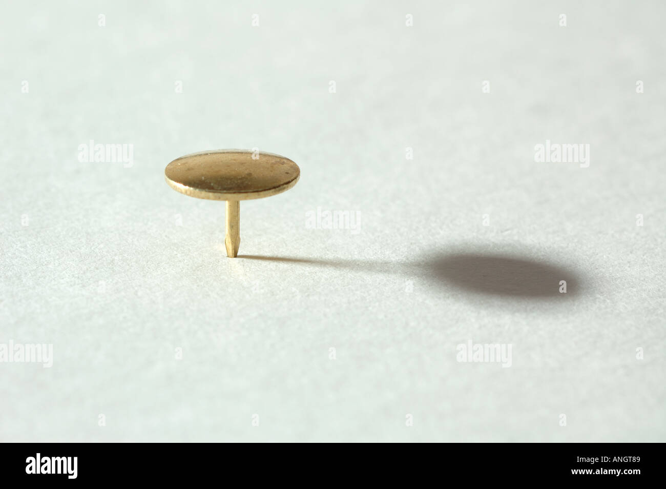 Drawing Pin close up with side lighting Stock Photo - Alamy